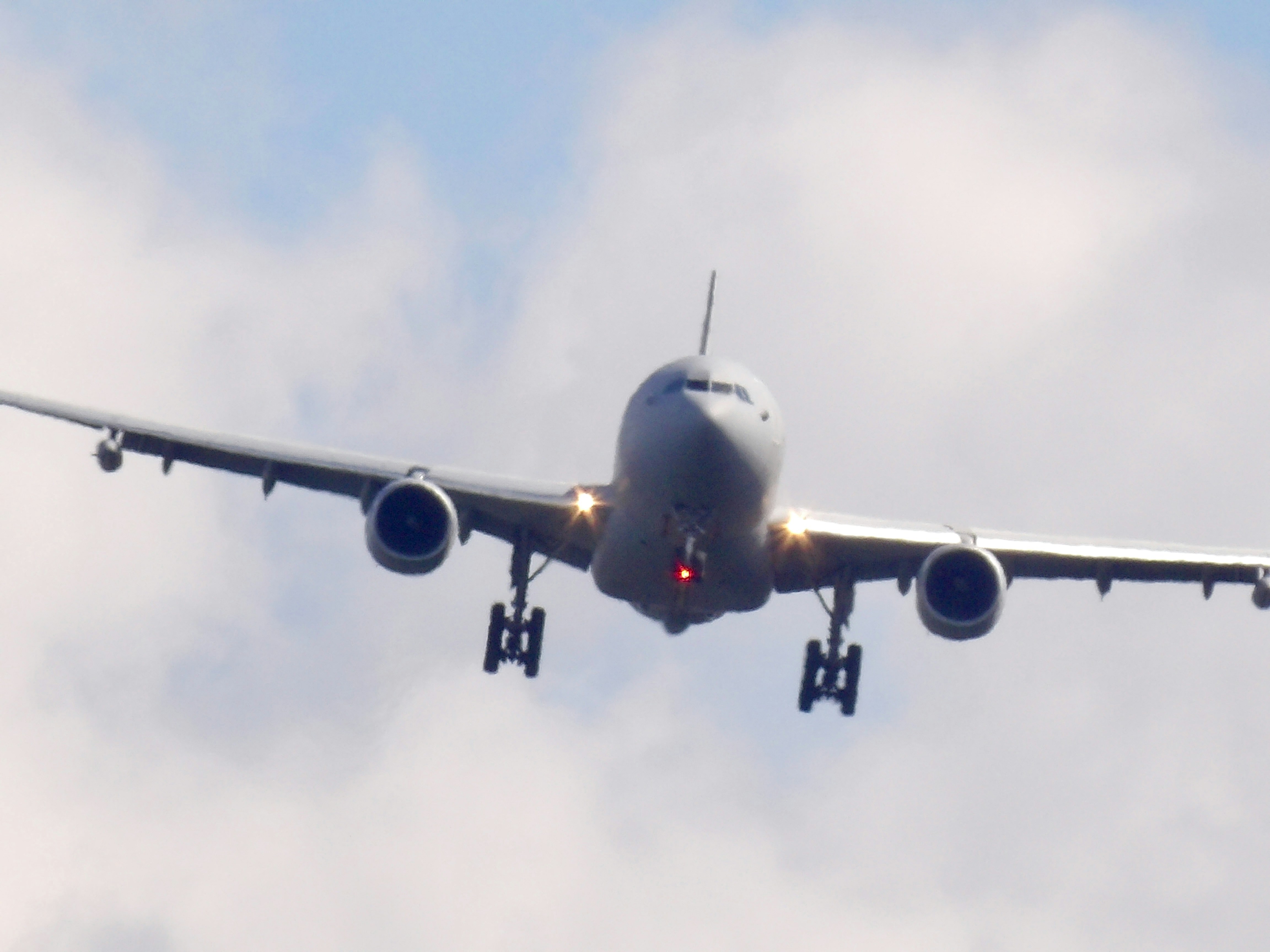A large airplane flying towards the camera.