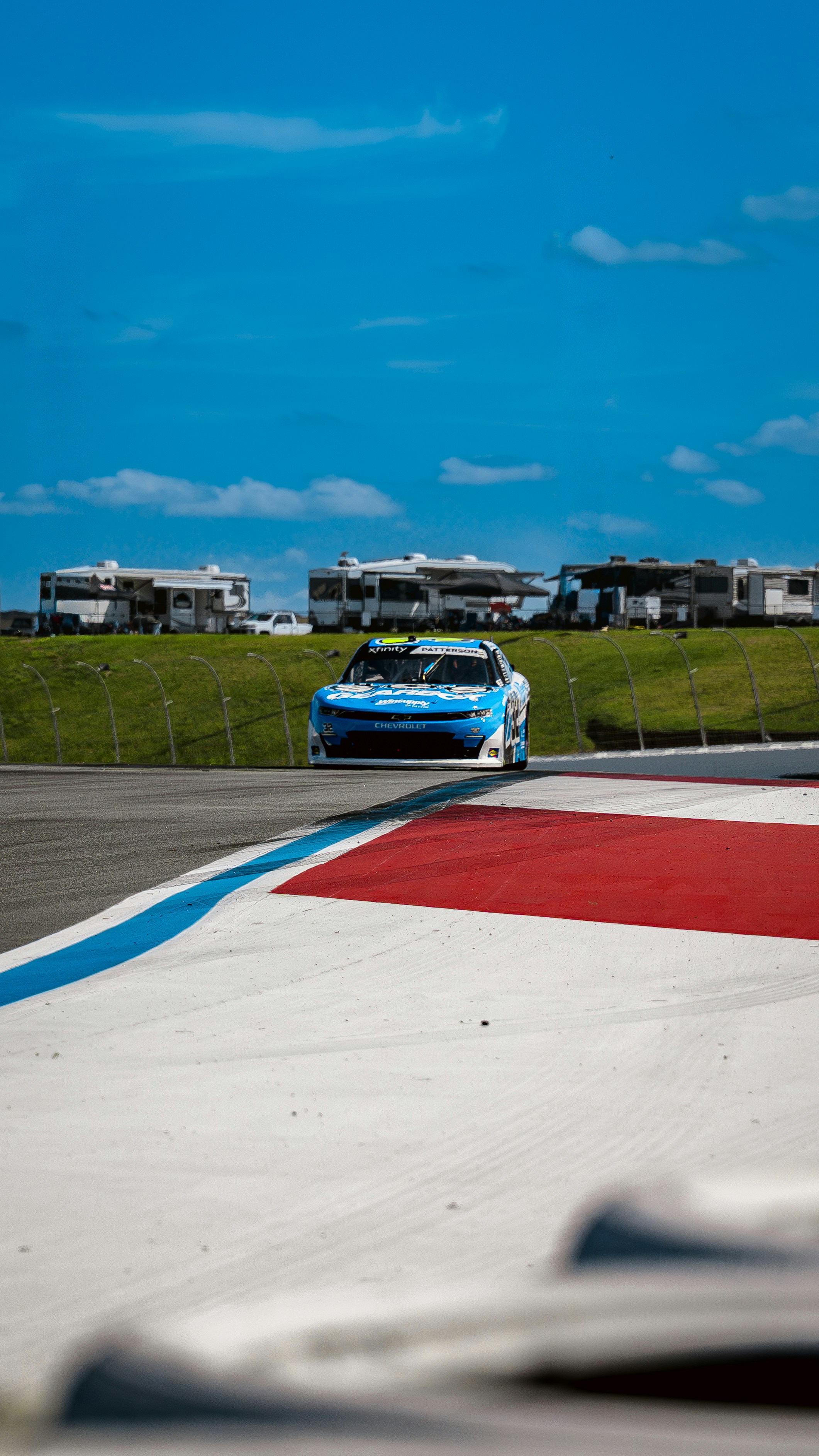 Racing Through the Curves: A Blue Streak on the Track