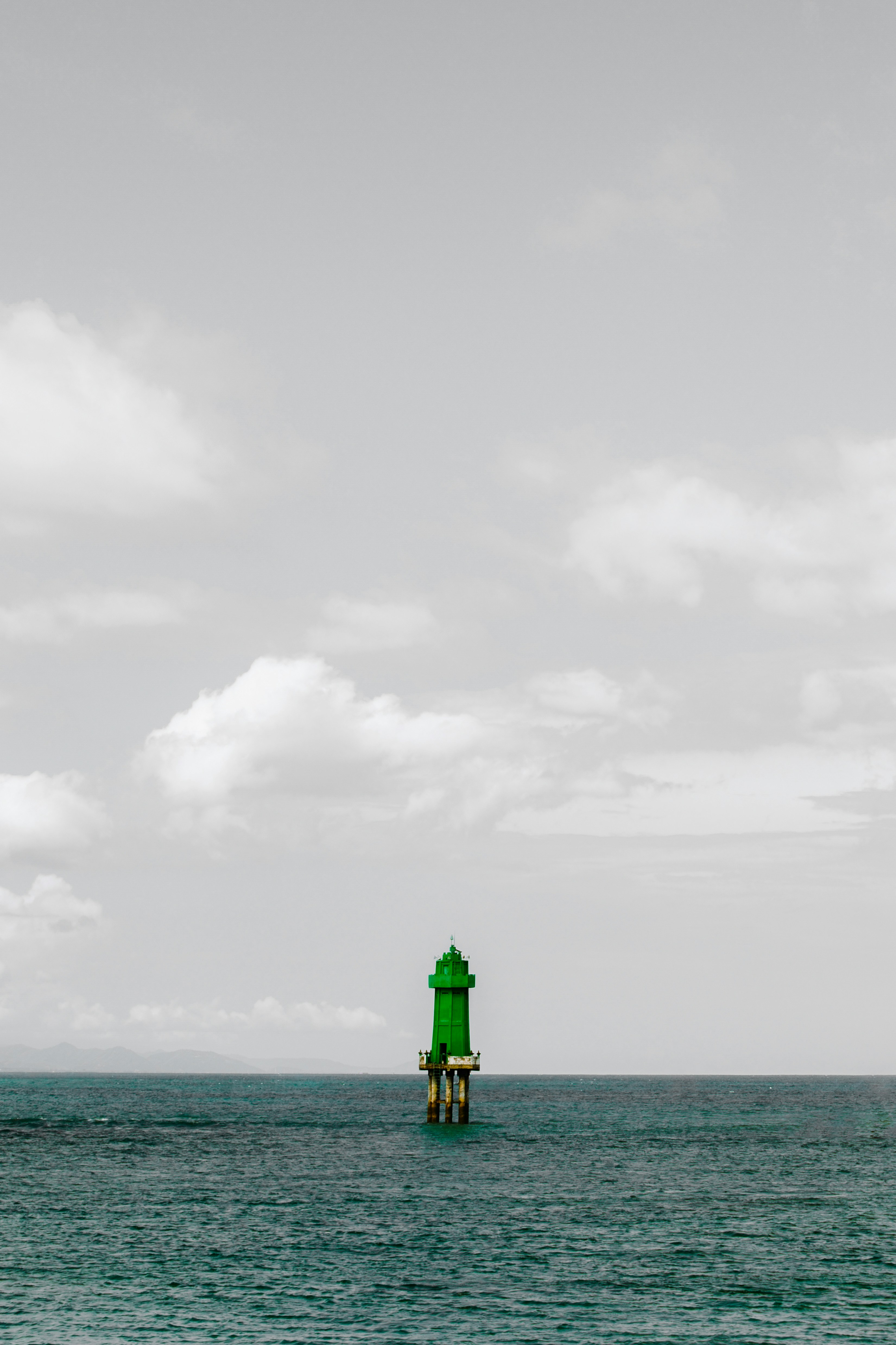 Emerald Beacon Amidst a Sea of Serenity