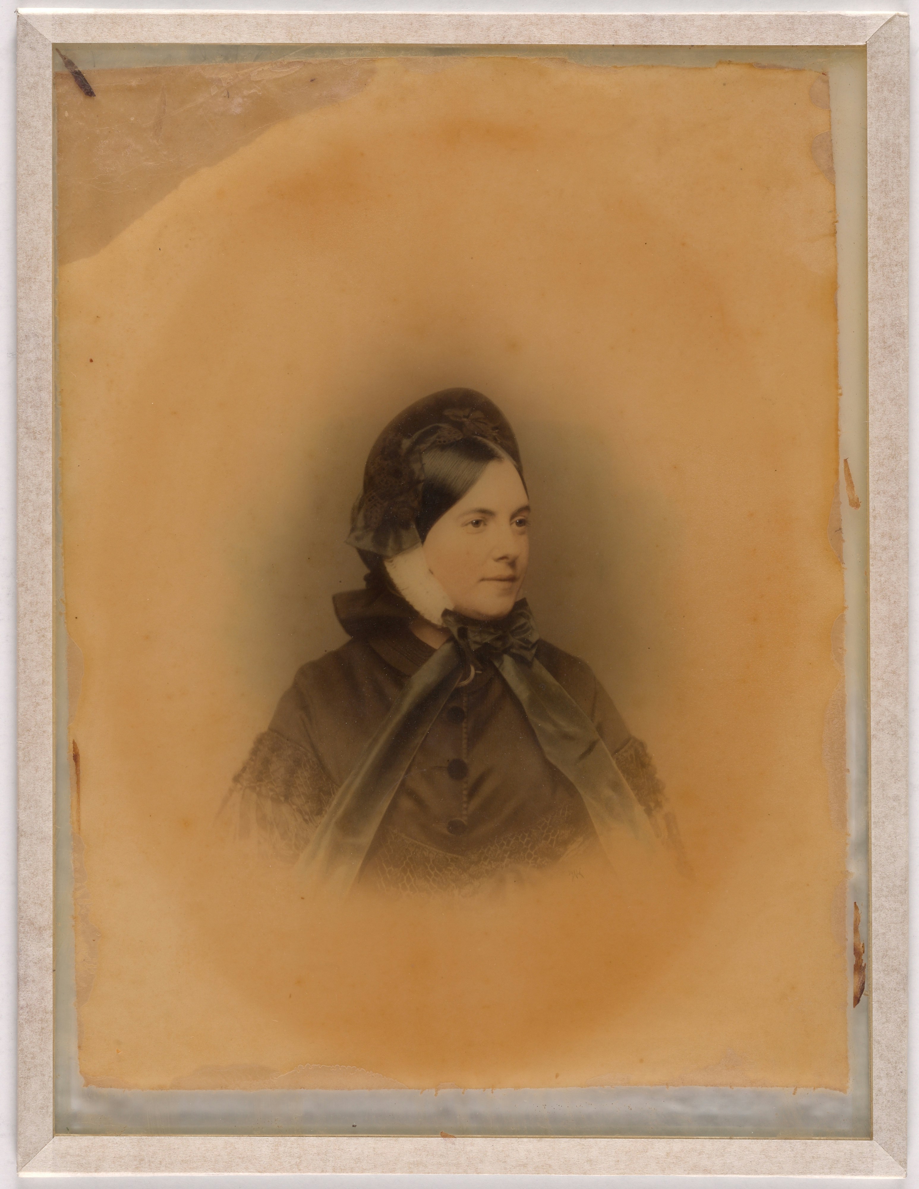 Pensive Portrait in Sepia: A Civil War–Era Woman in Faded Glass