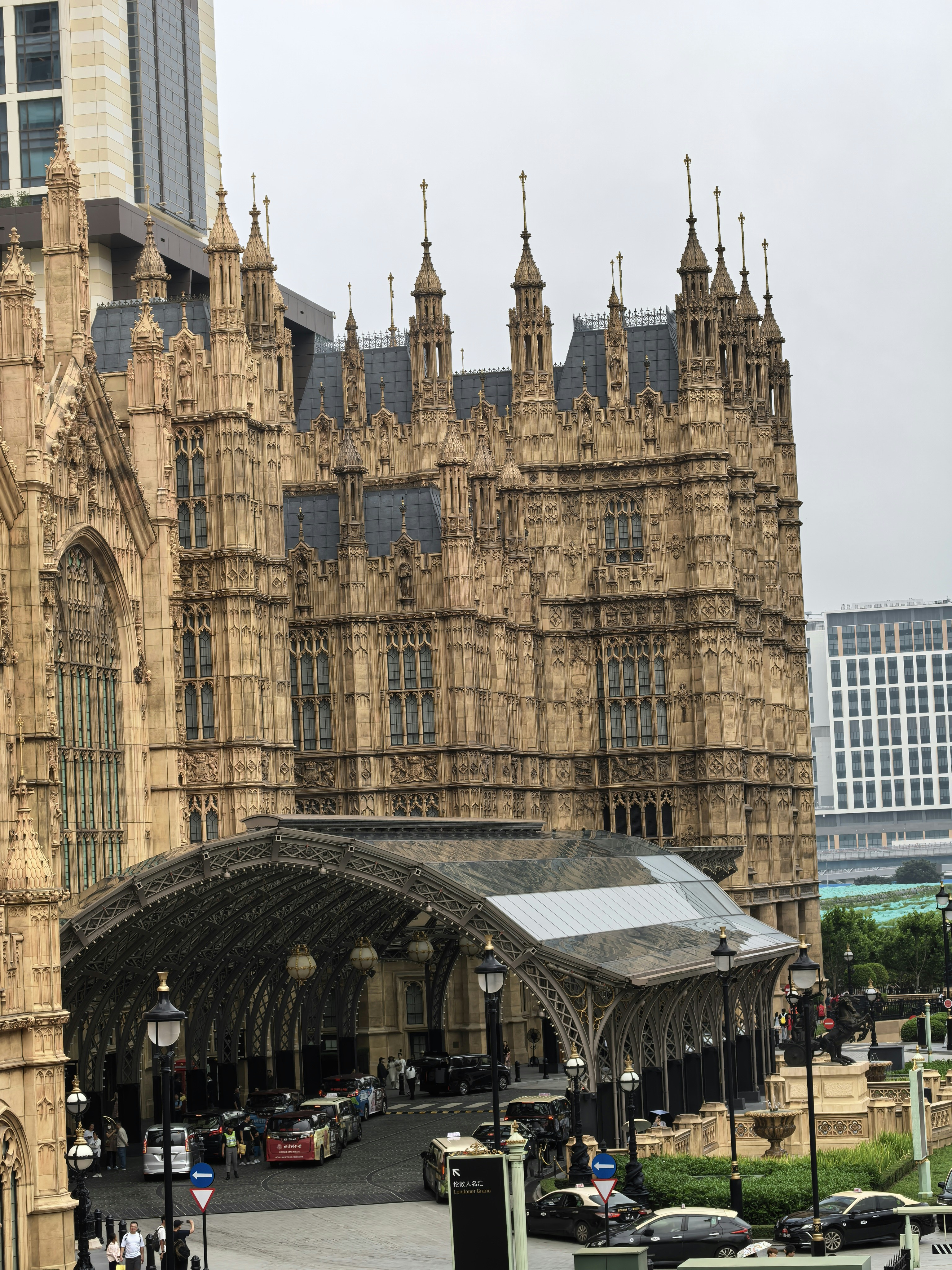 Gothic Facade Under a Curved Glass Canopy