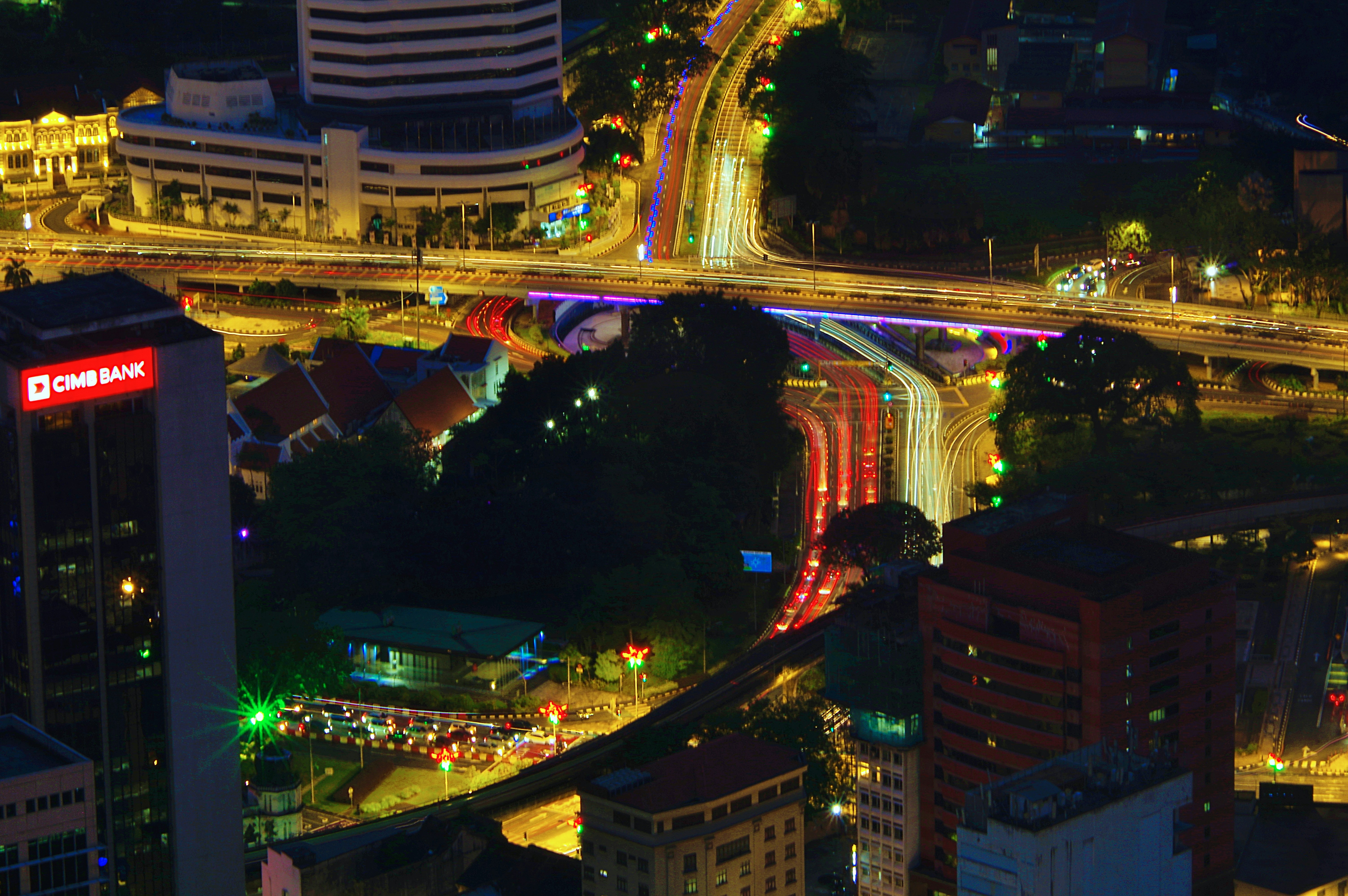Cityscape at night with illuminated buildings and roads
