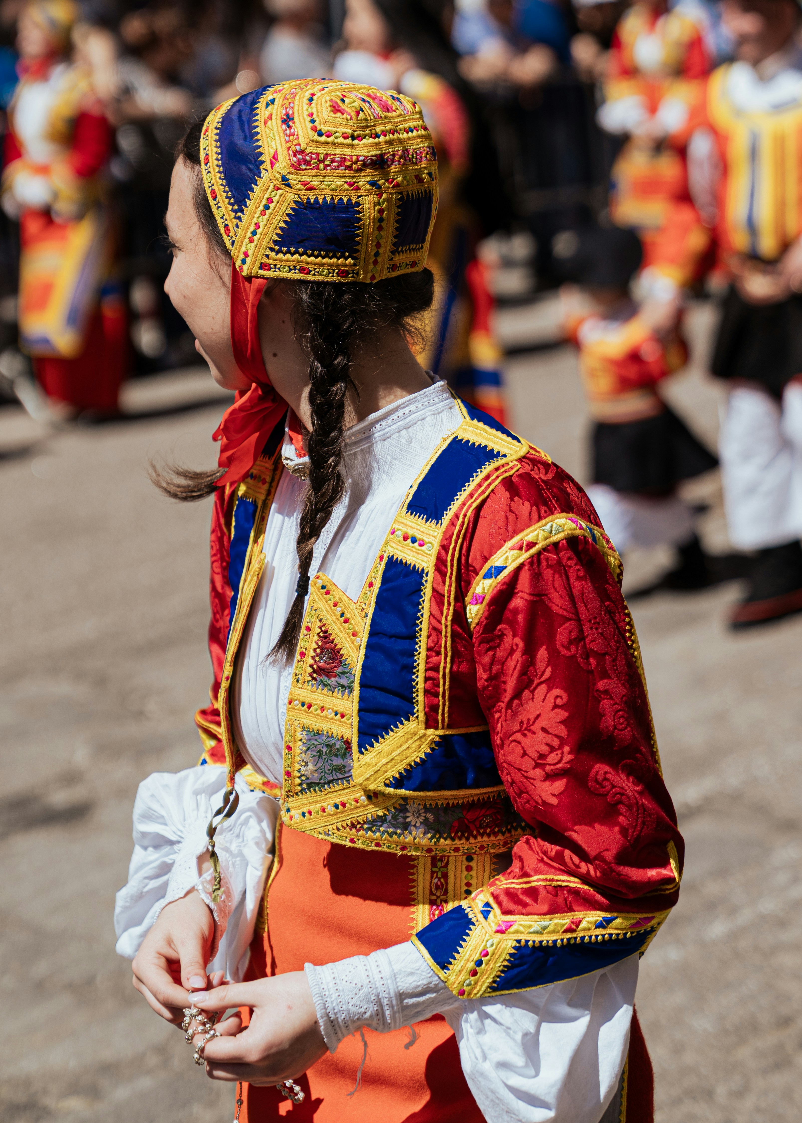 may 1 2025 | Woman in traditional colorful clothing with braided hair