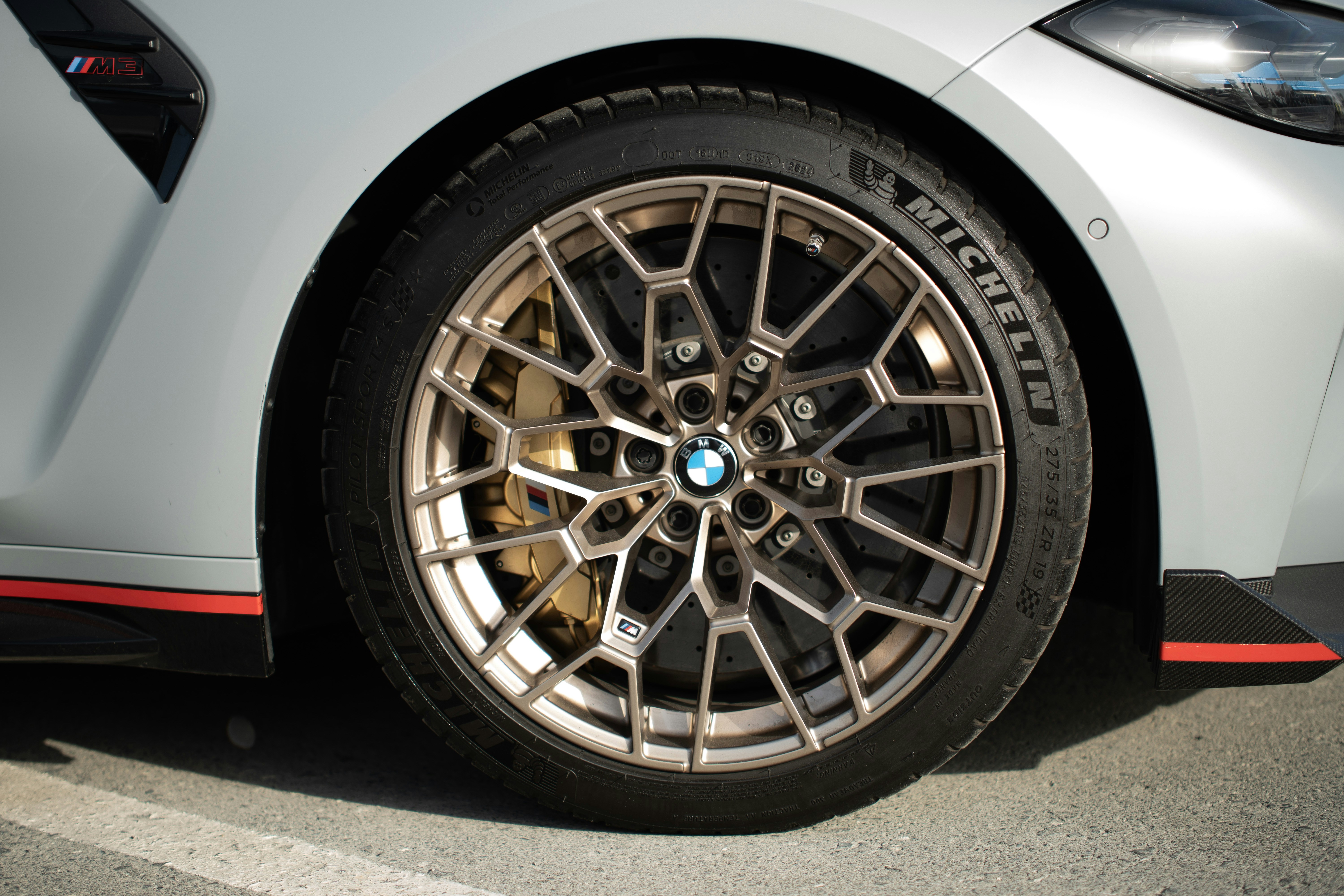 Close-up of a modern car wheel with intricate design.