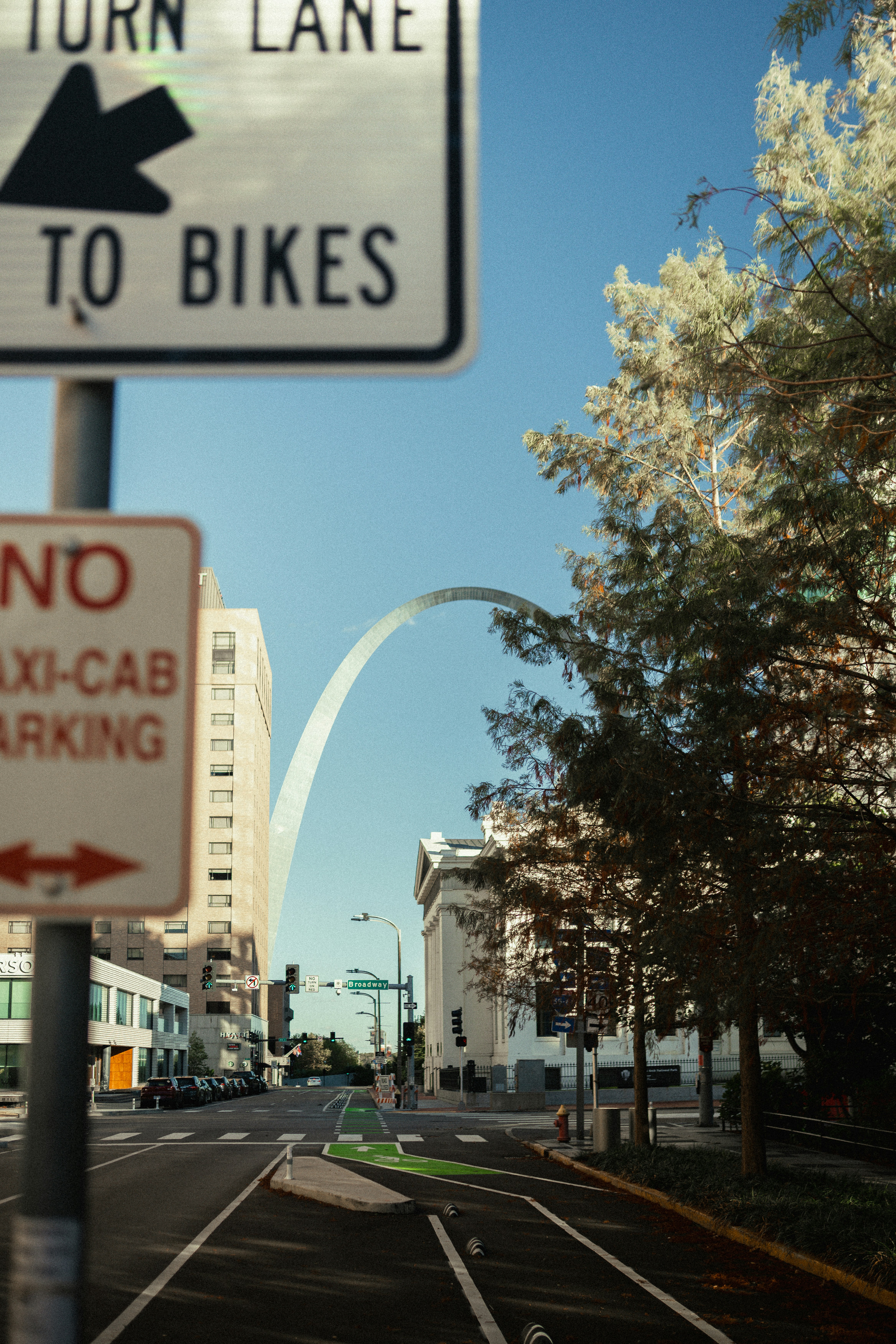 Gateway arch visible from a city street.