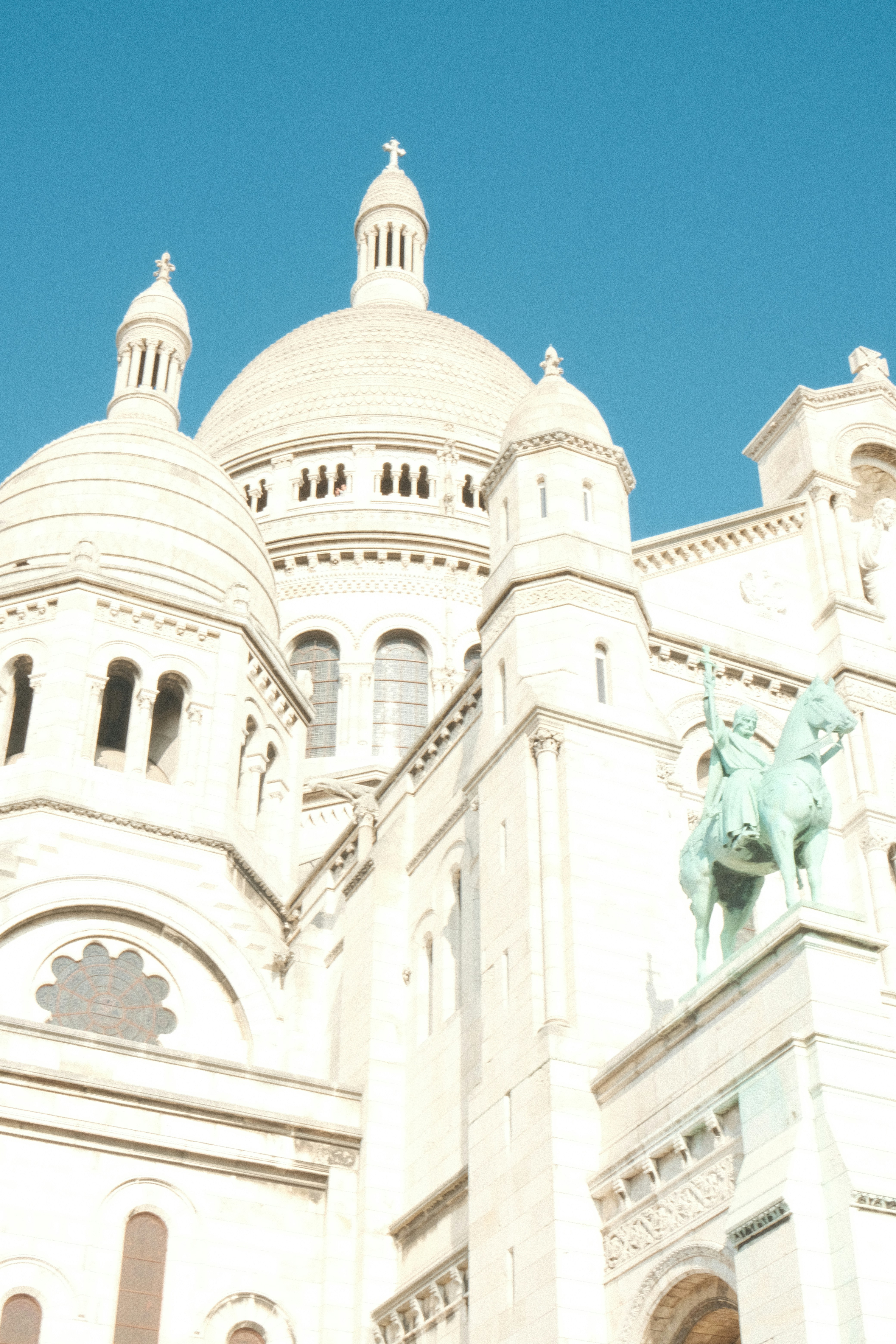 White domed building with a statue of a horseman.