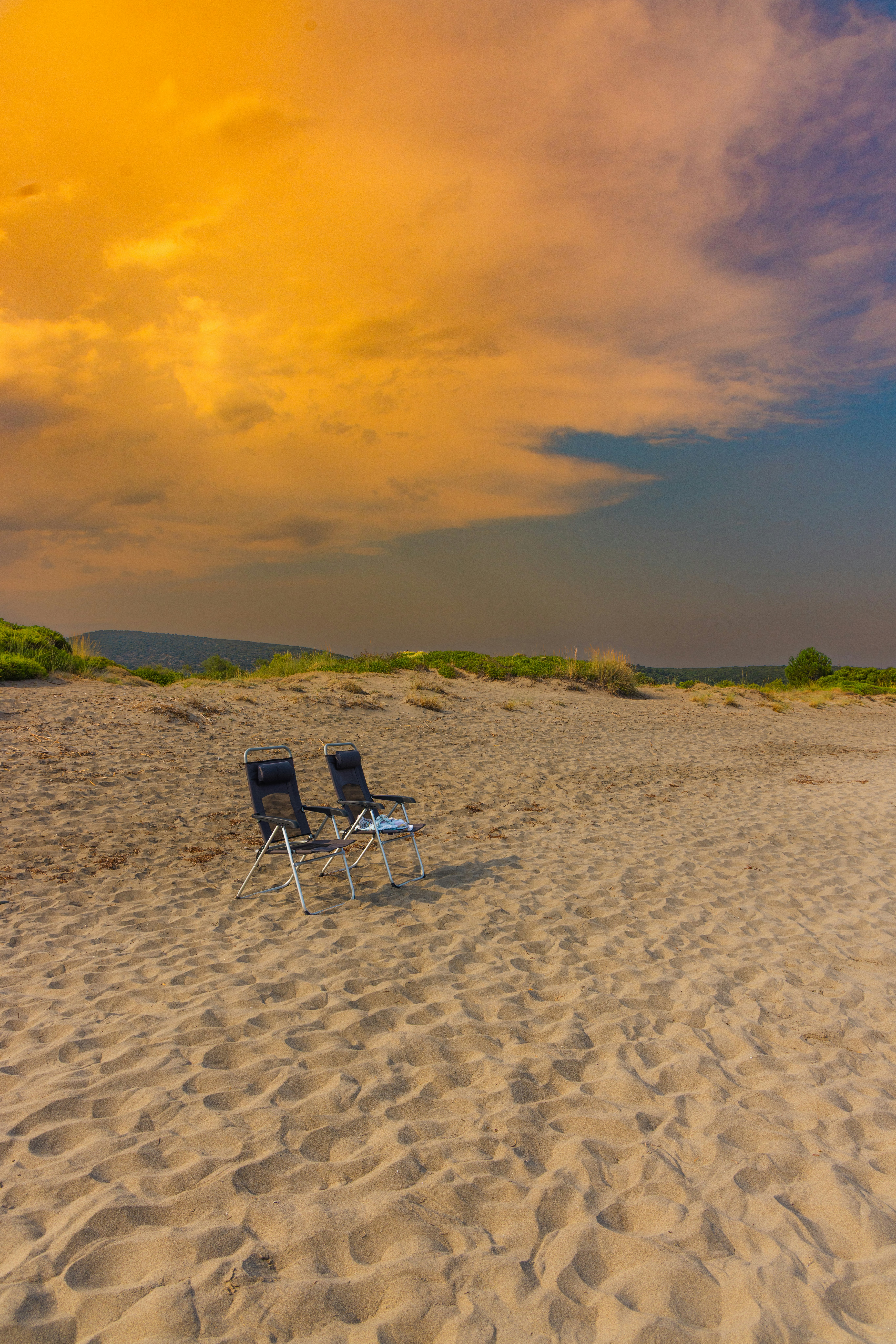 Two chairs on a sandy beach at sunset photo – Free Beach Image on Unsplash