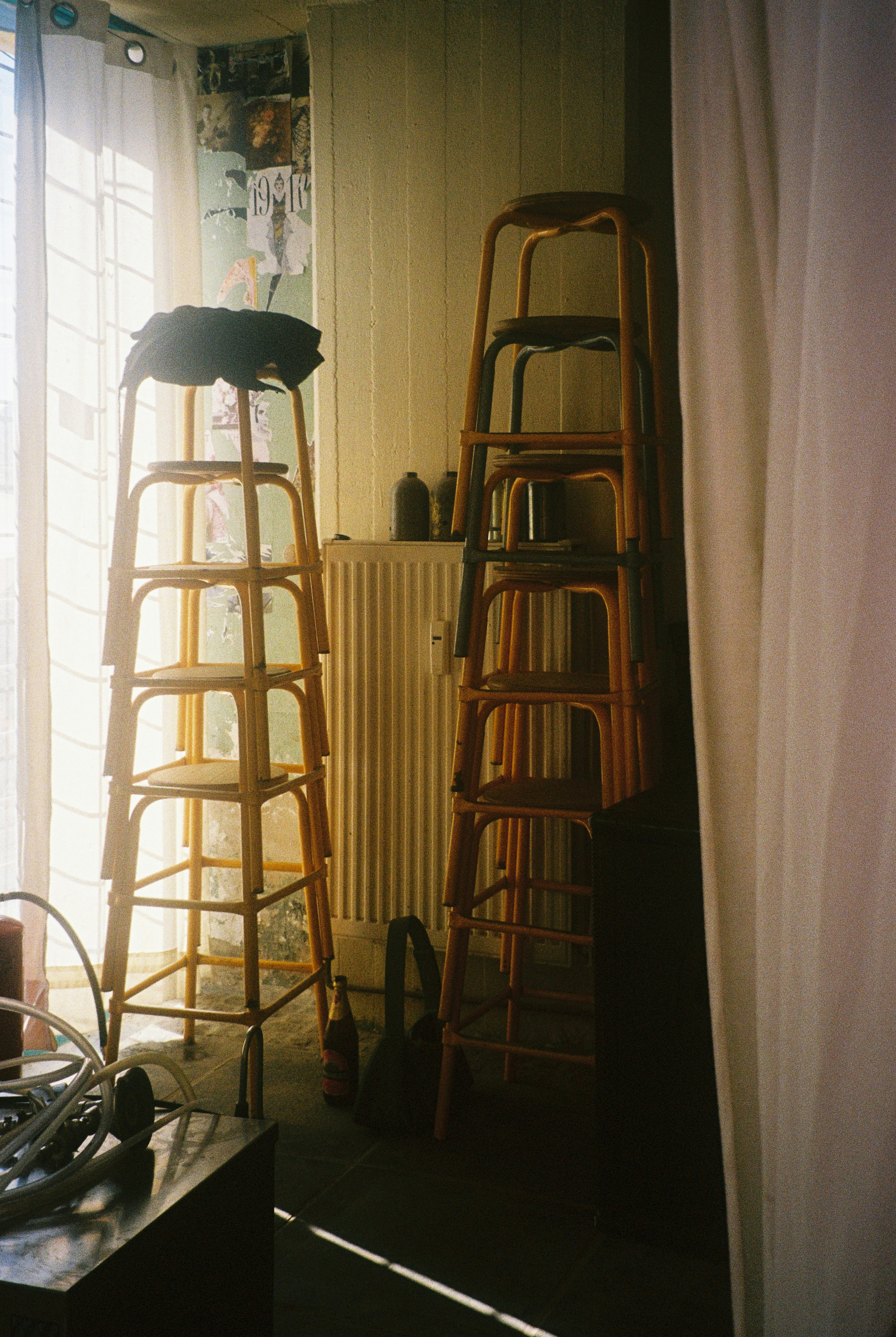 Shot on Kodak UltraMax 400 | Stack of wooden stools near a window