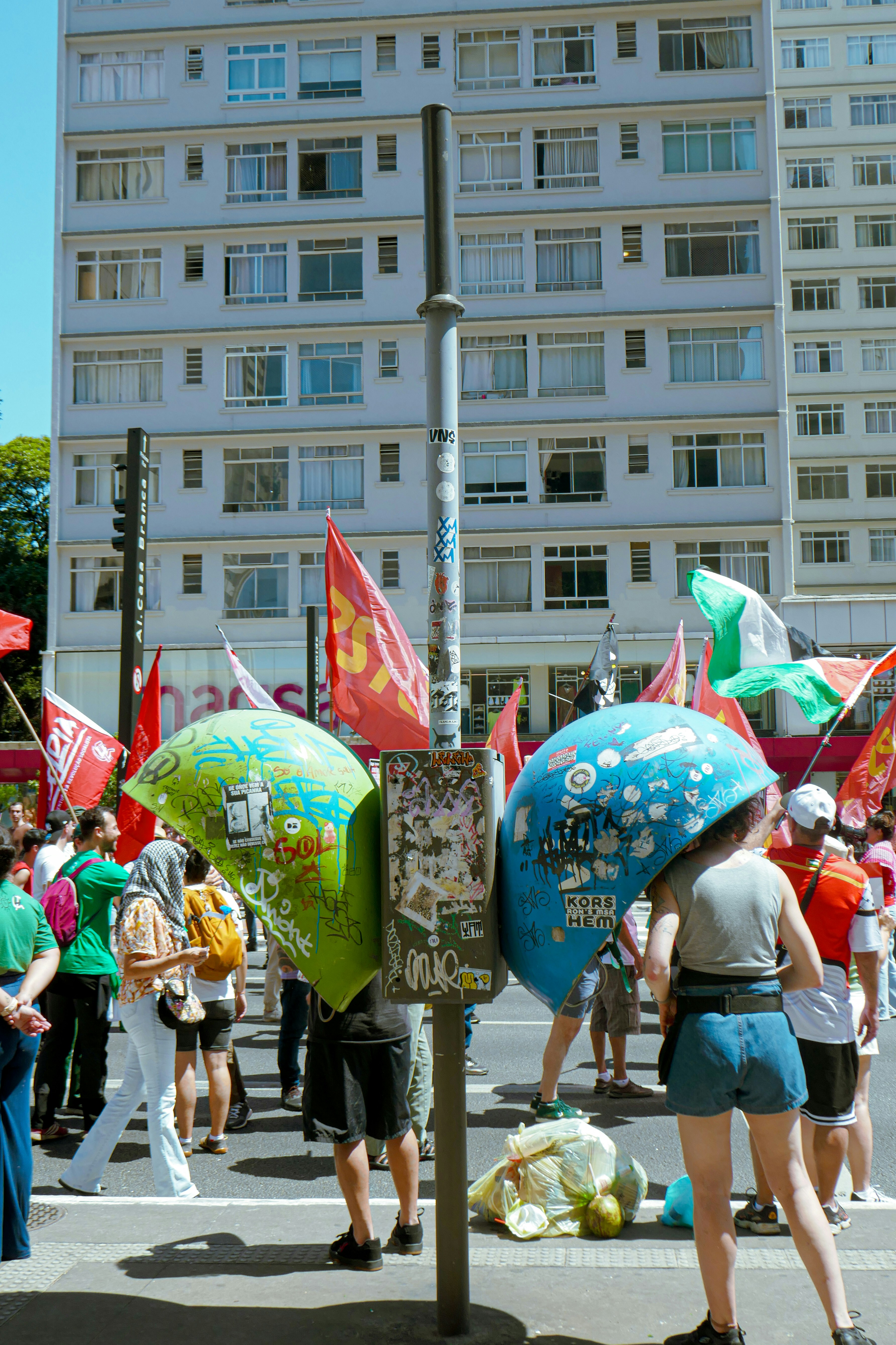 People gathered with flags and decorated phone booths.
