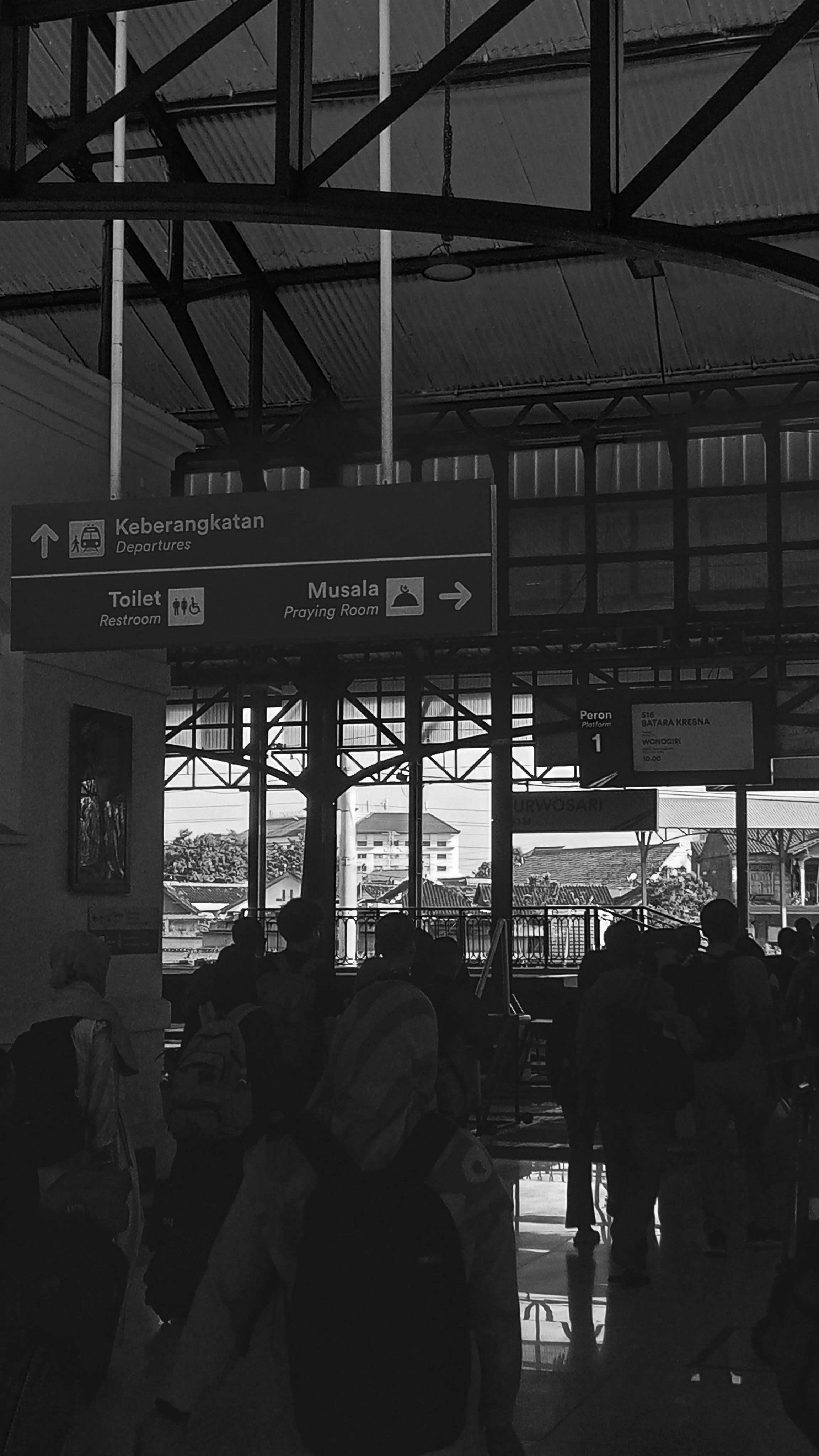 Transport, motorways and tramlines Starting and then stopping - Let Down | People waiting inside a train station with signs.
