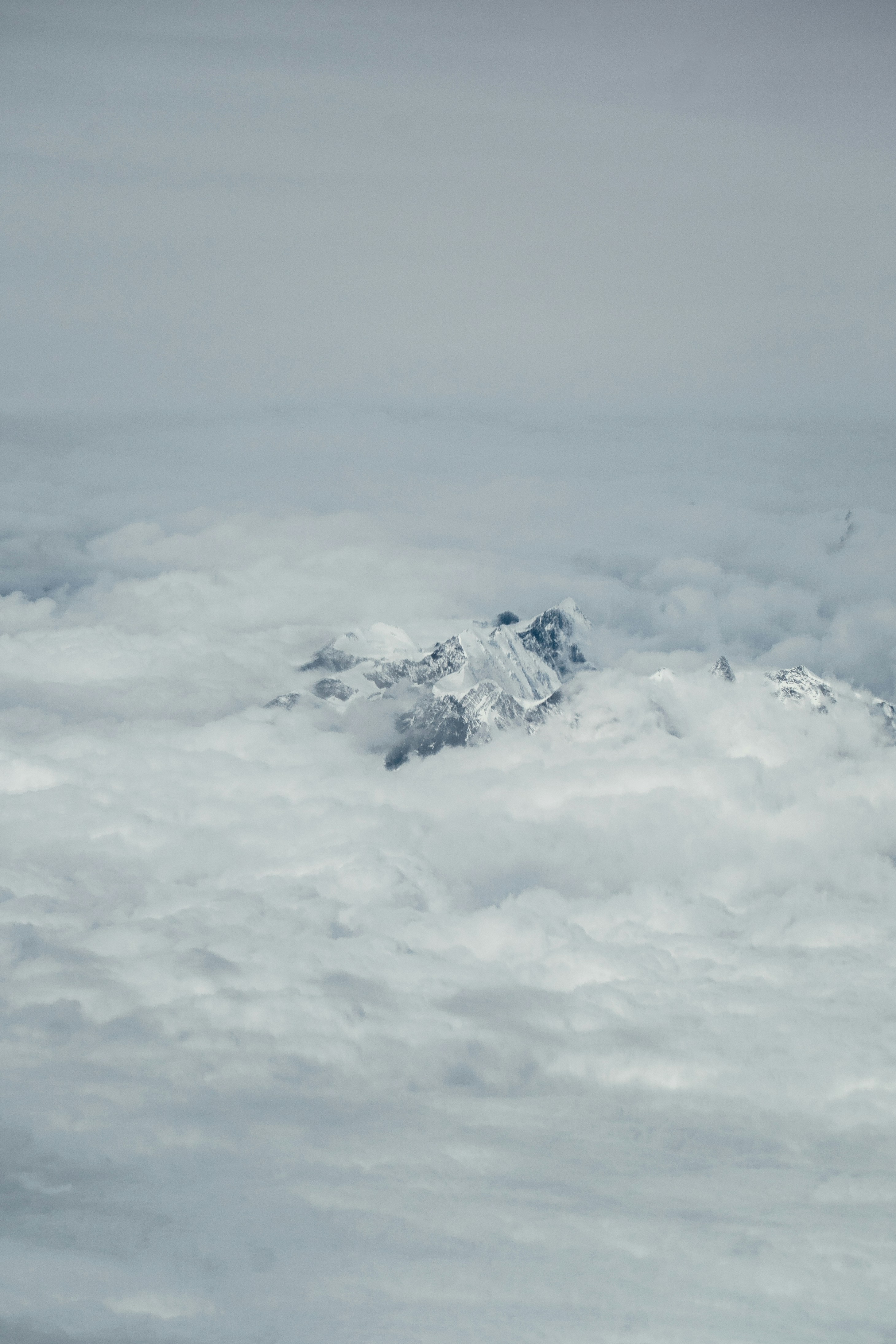 Veiled Peaks: A Mountain's Silent Vigil