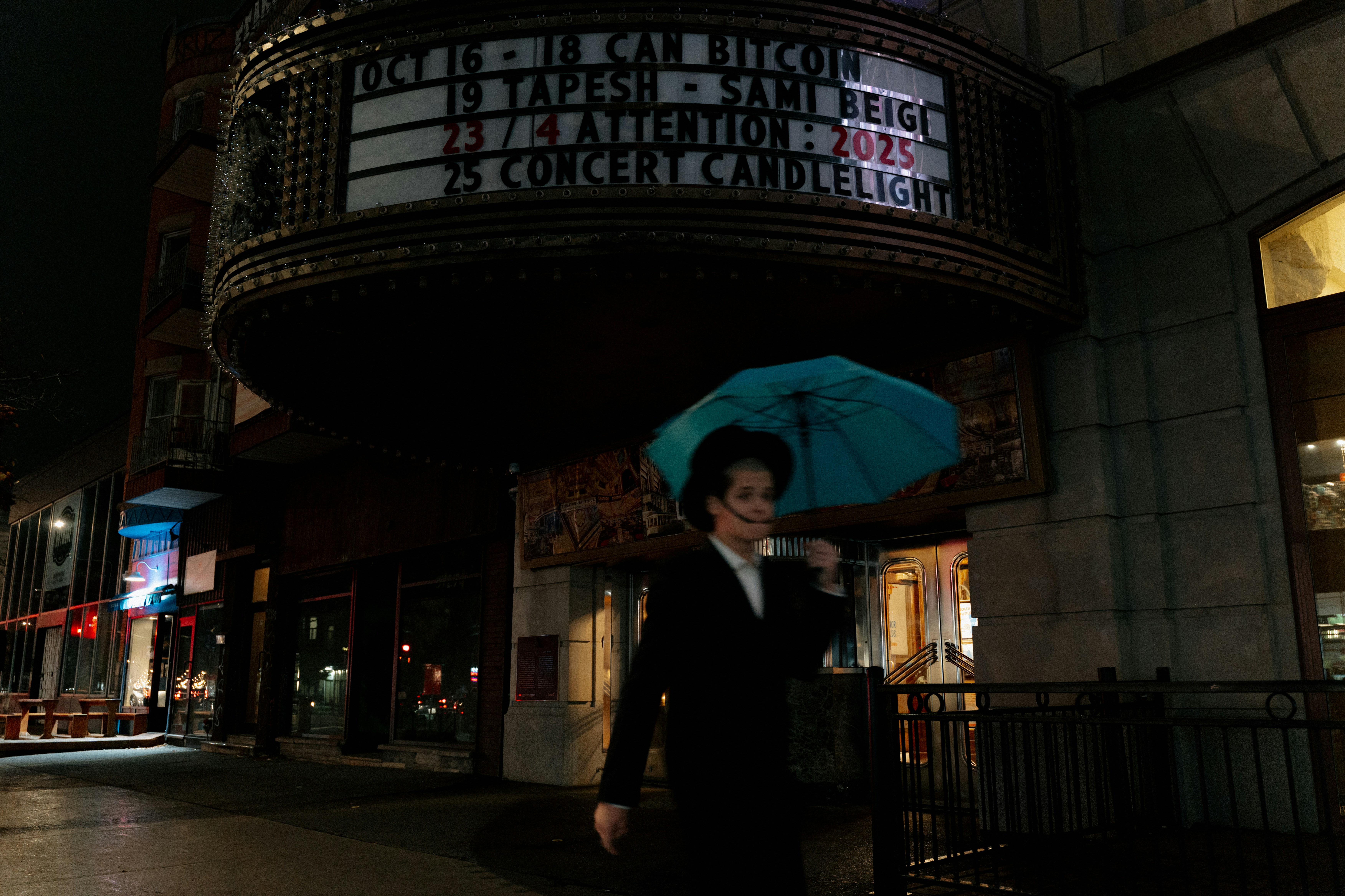 Umbrella in the Night: A Stroll Under Neon Lights