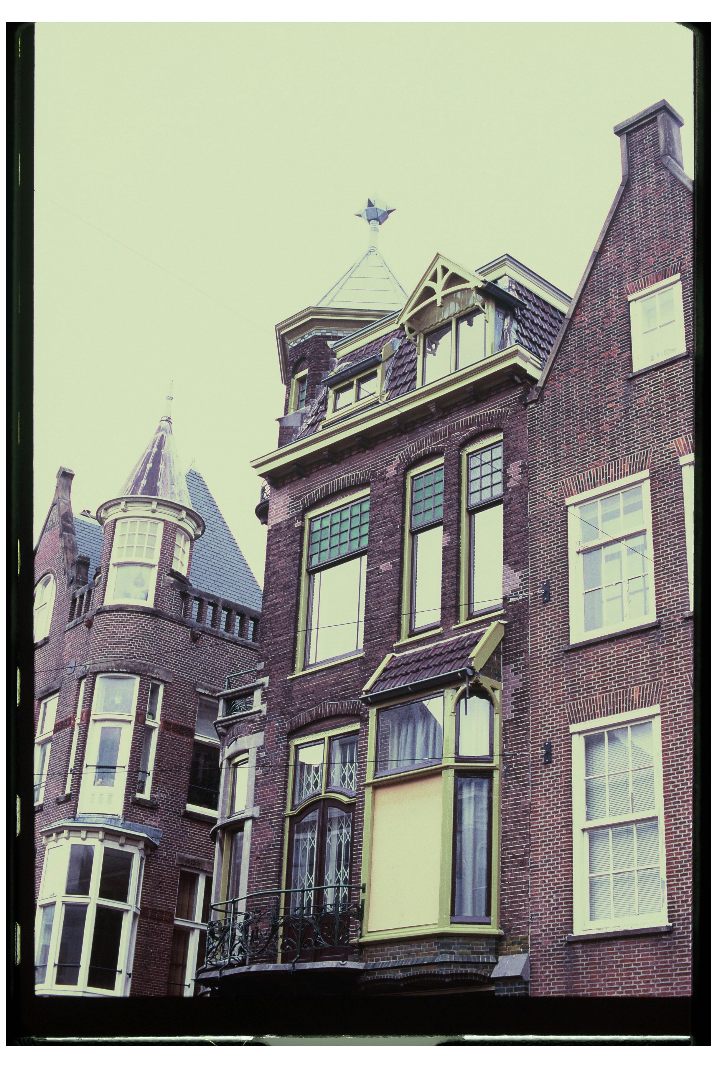 Pastel-Toned Gables: A Row of Dutch-Style Brick Facades