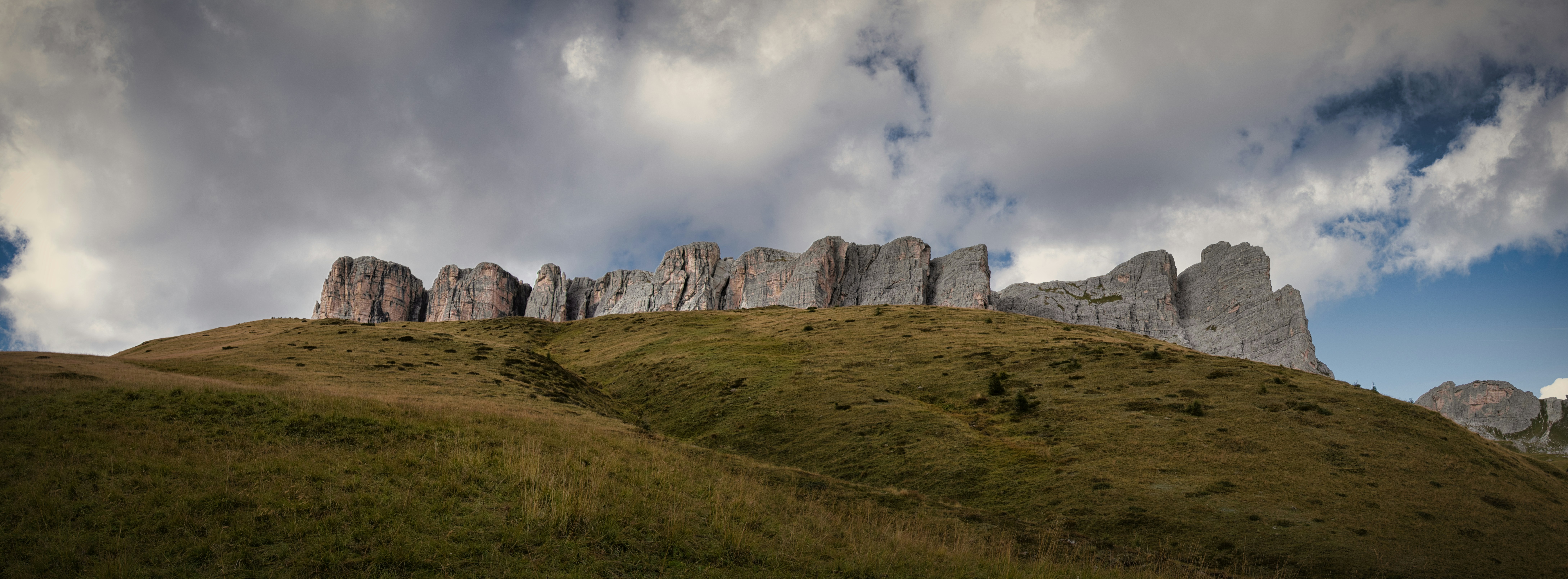 Jagged mountain range under cloudy sky photo – Free Travel Image on Unsplash