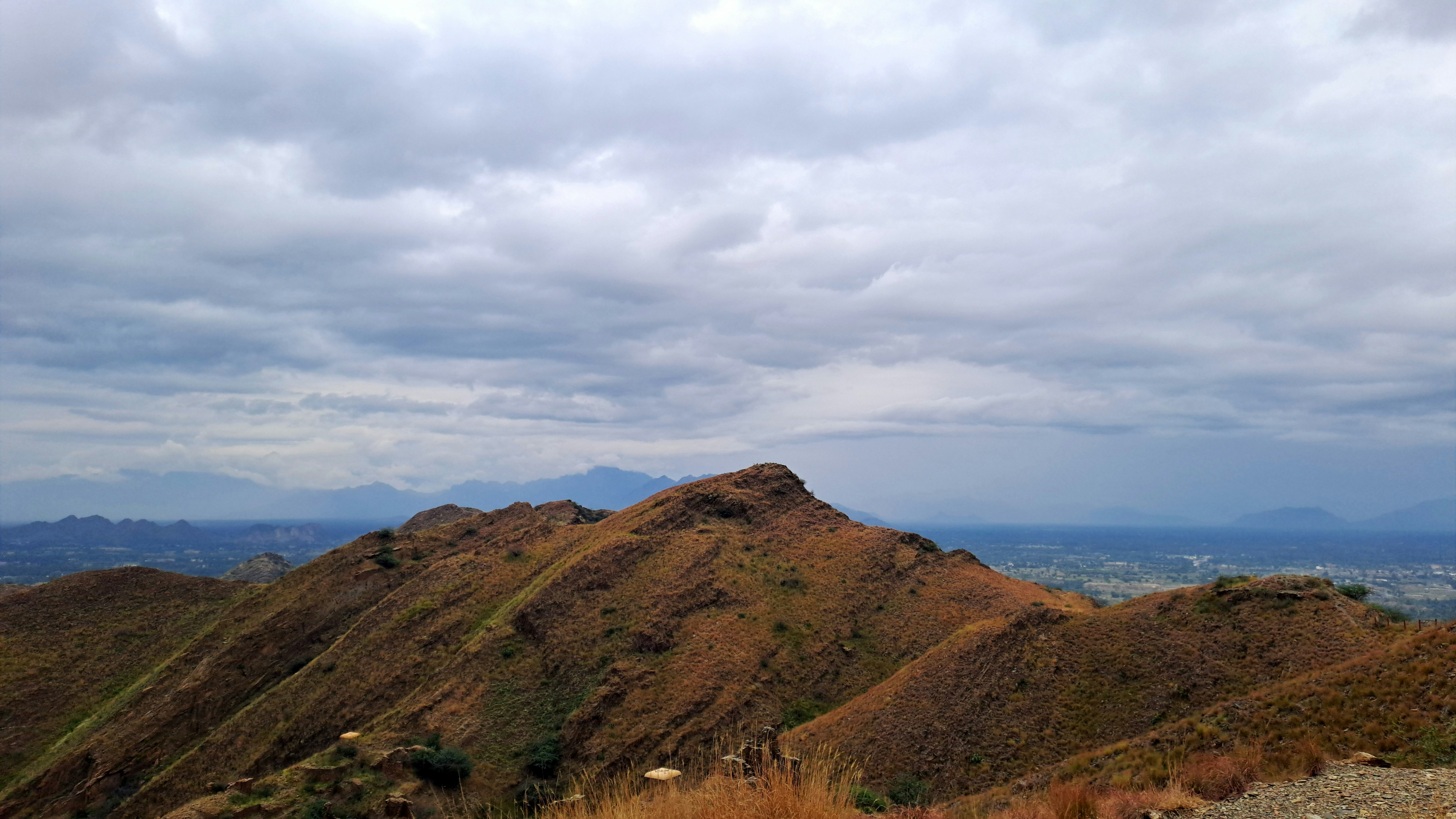 Brown hills under a cloudy sky