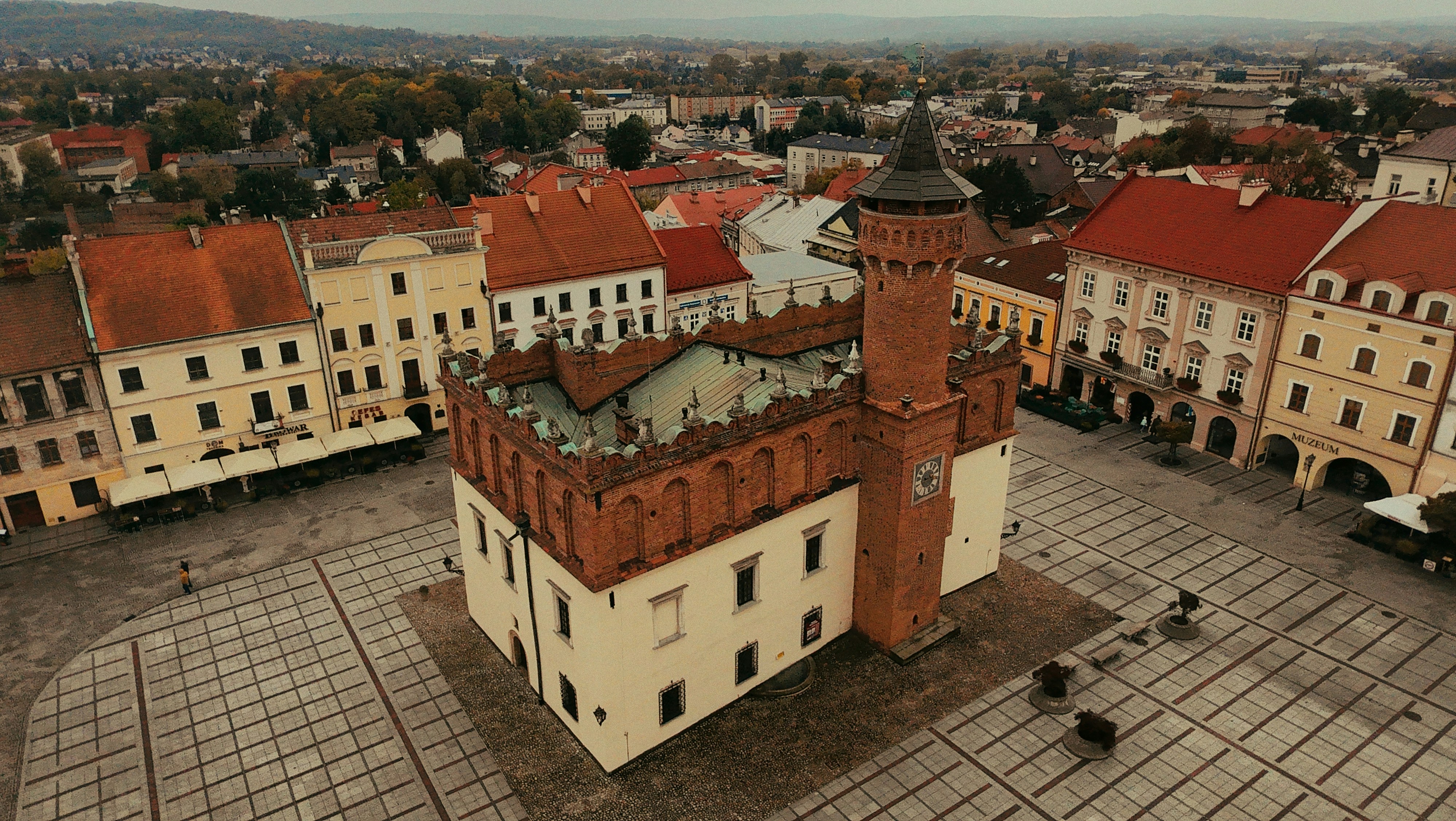 Historic town square with a prominent brick building.