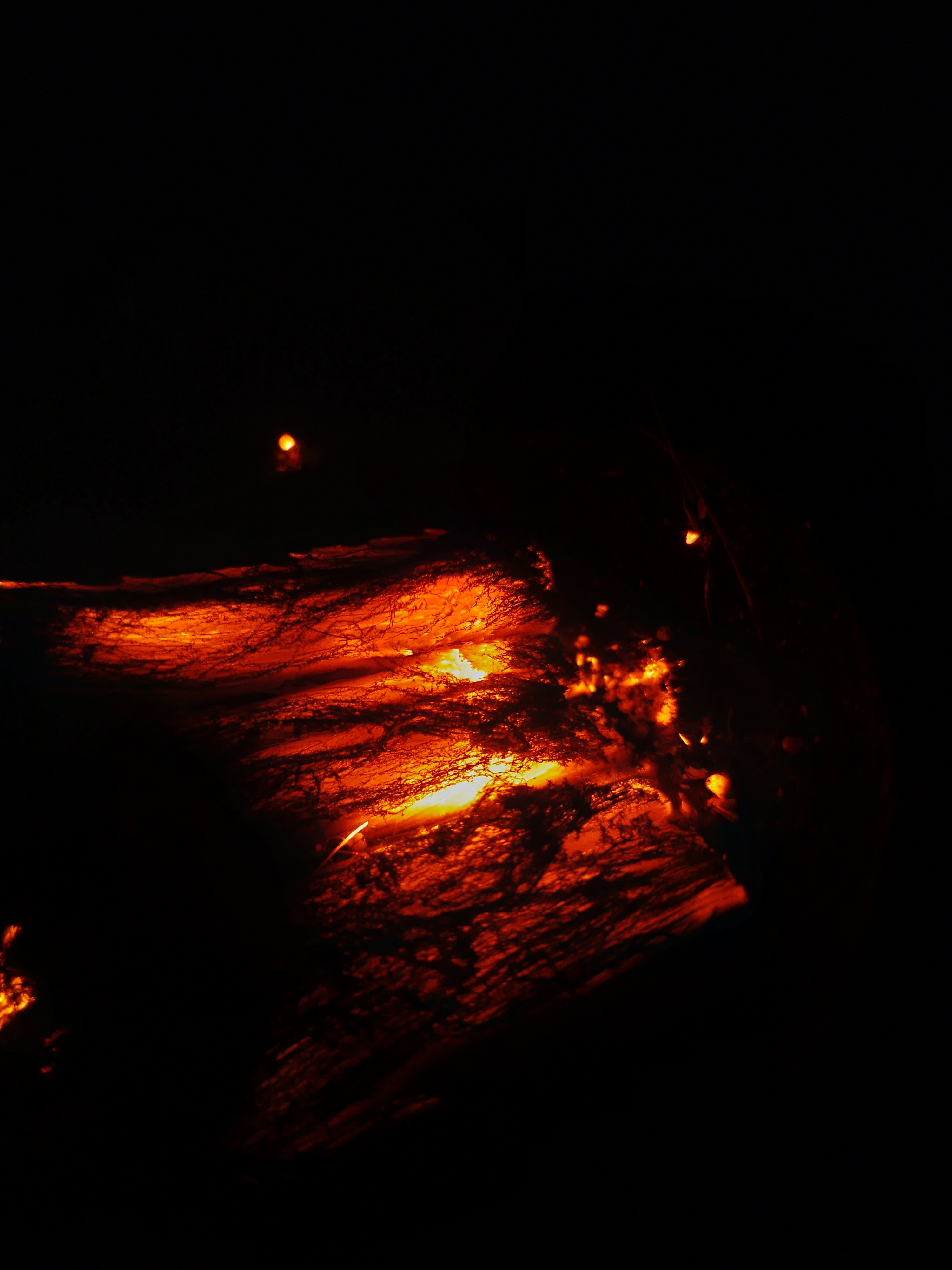 Molten lava flowing in the dark night.