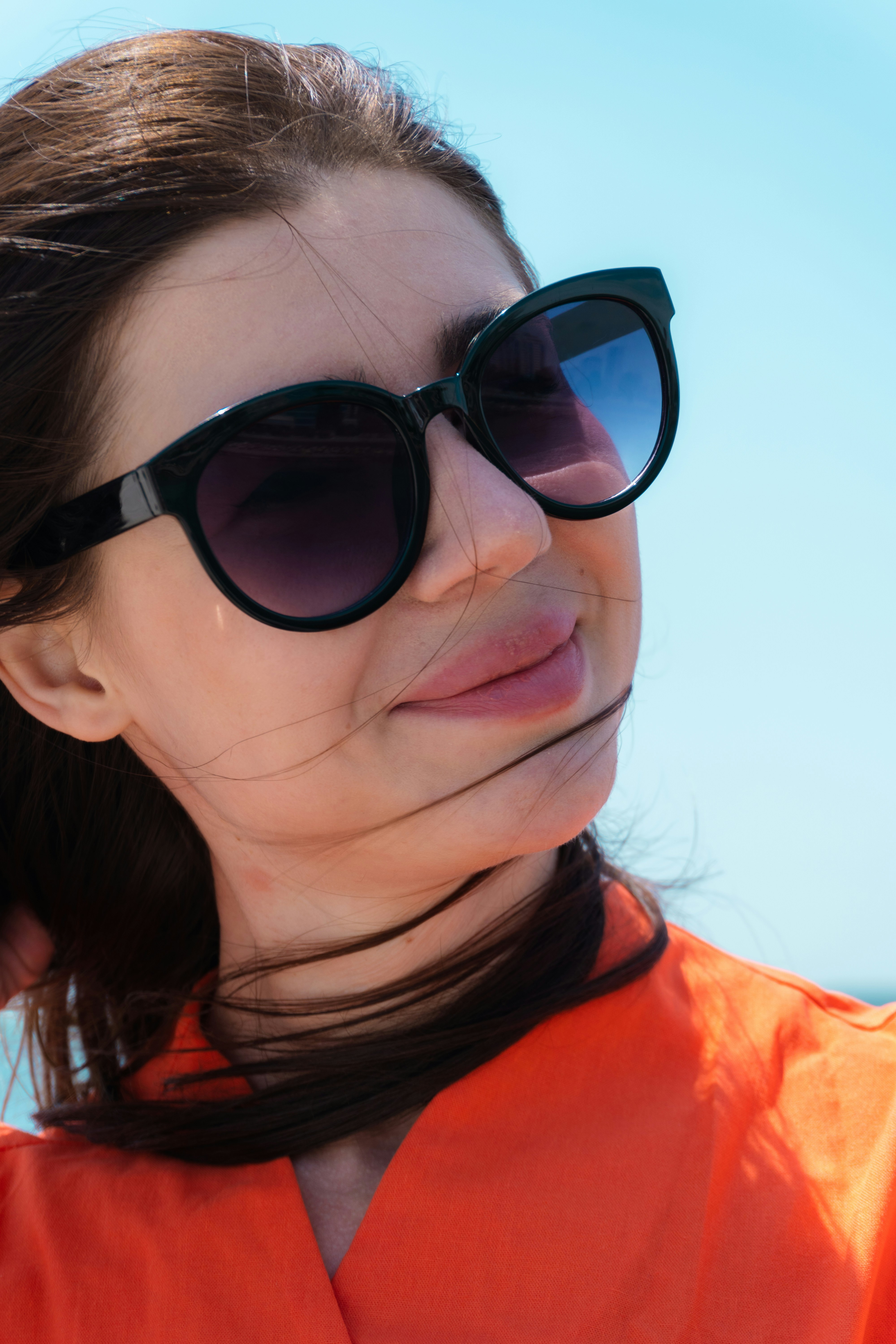 Wind-Touched Portrait Under Piercing Blue Sky