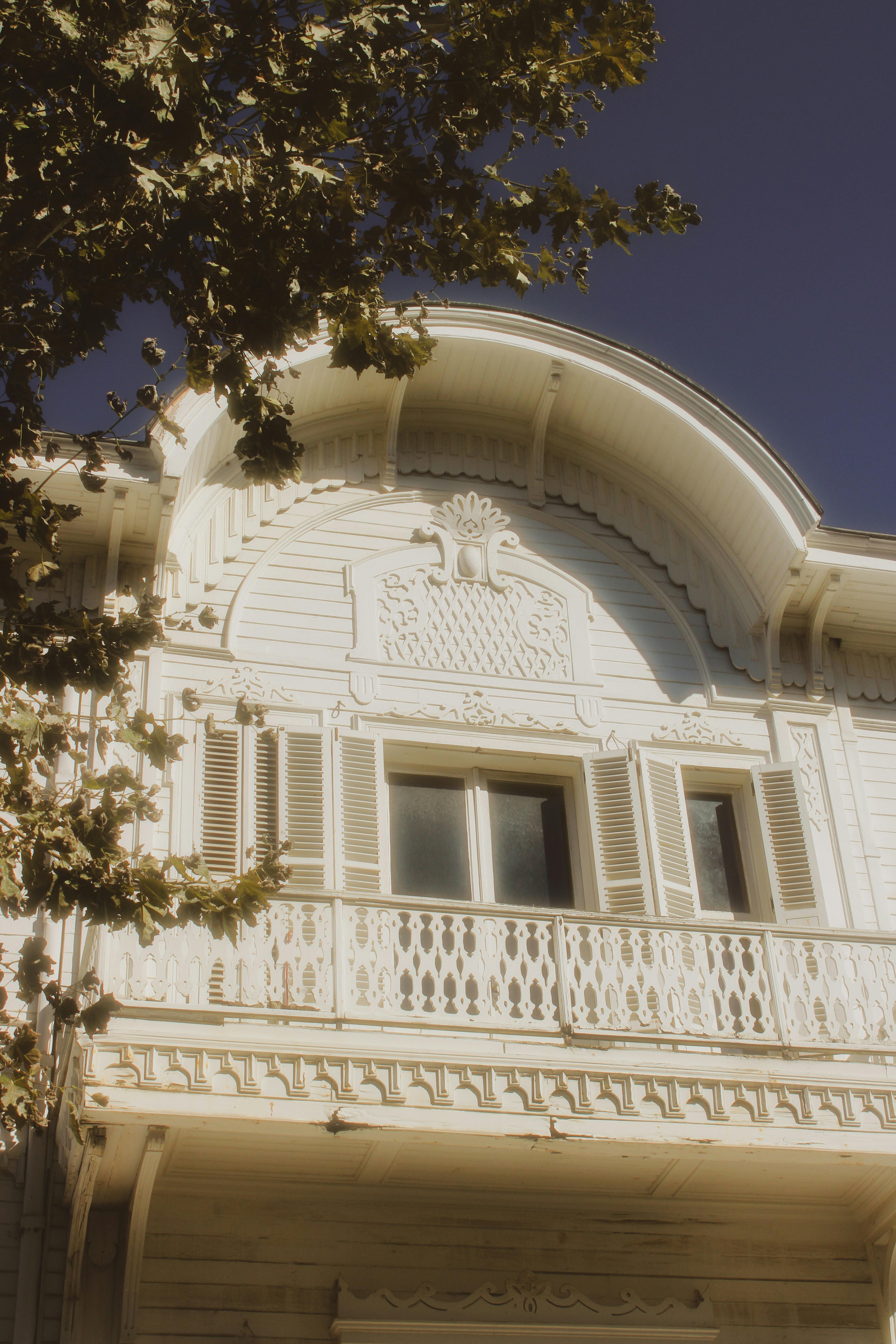 White ornate balcony on a historic building