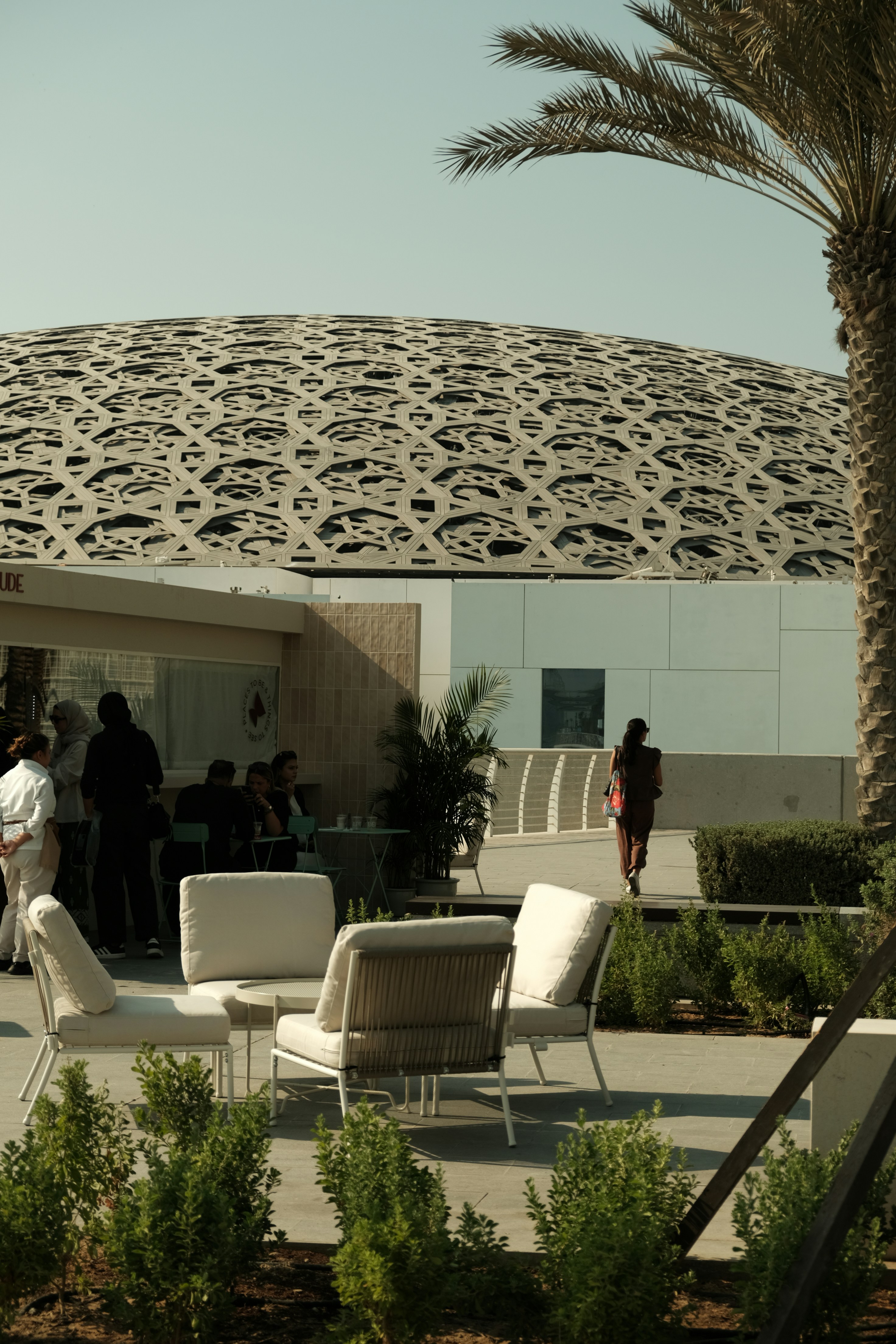 Lattice Horizon: Palm-Framed Seating Beneath a Geometric Dome