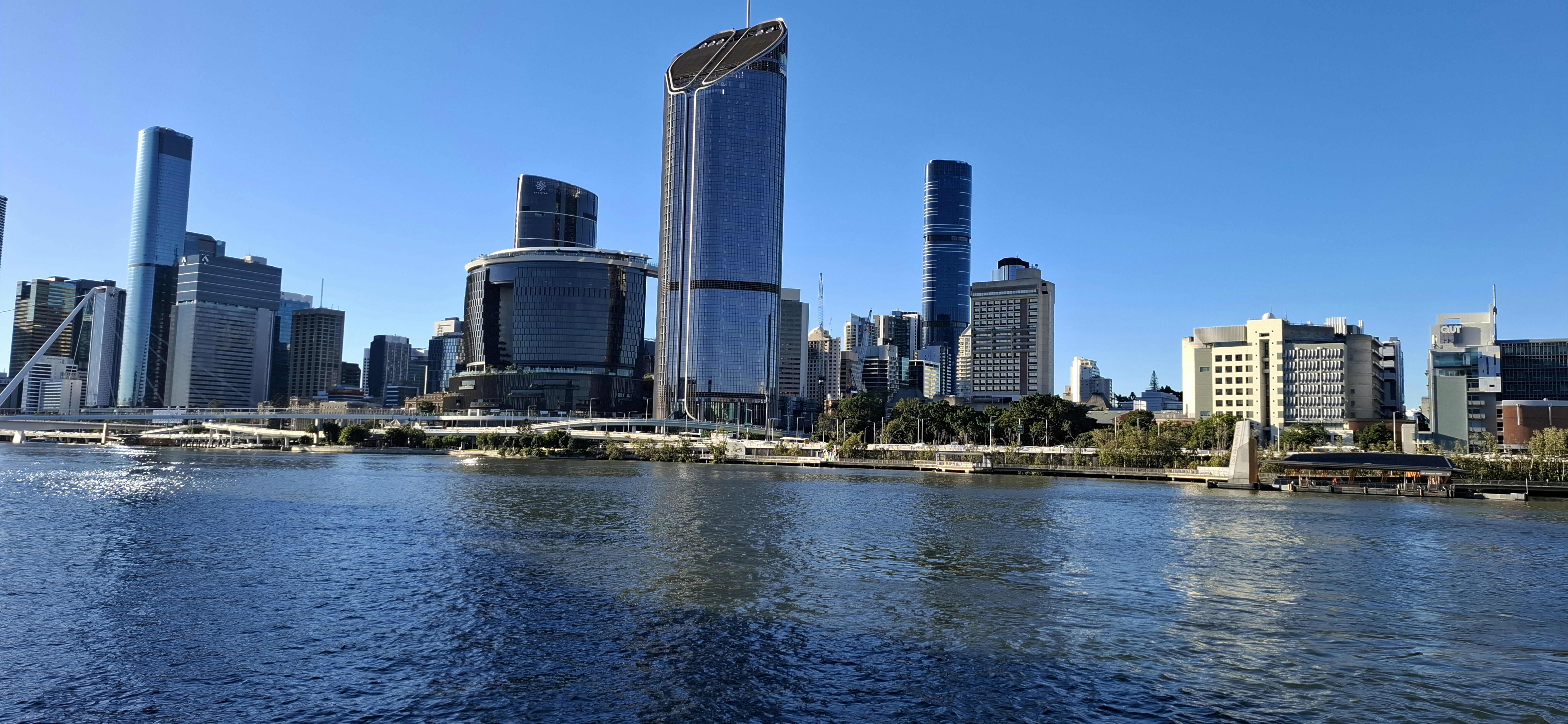 Beautiful Brisbane City photo with Brisbane River & Buildings | City skyline with modern skyscrapers reflected in water.