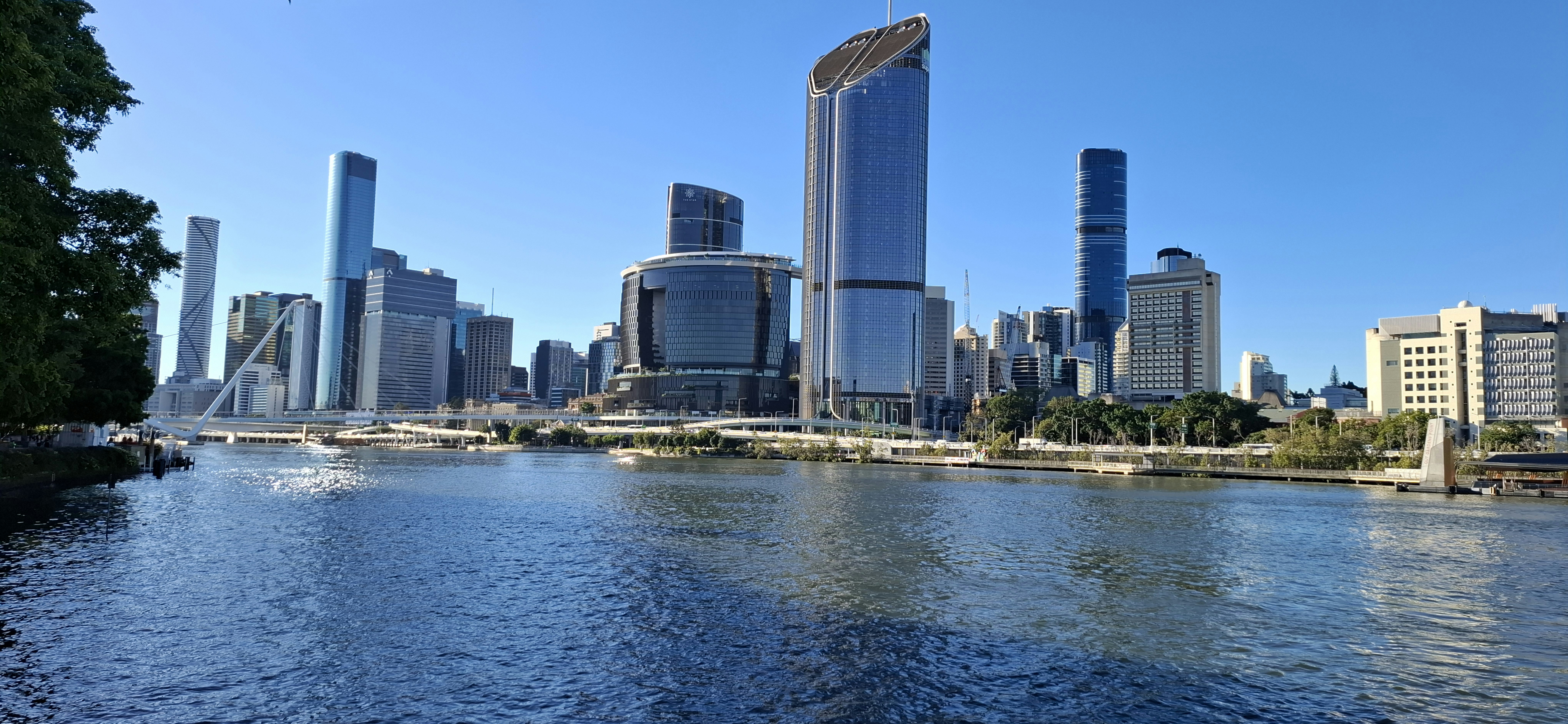 Beautiful Brisbane City photo with Brisbane River & Buildings | City skyline with modern skyscrapers across a wide river.