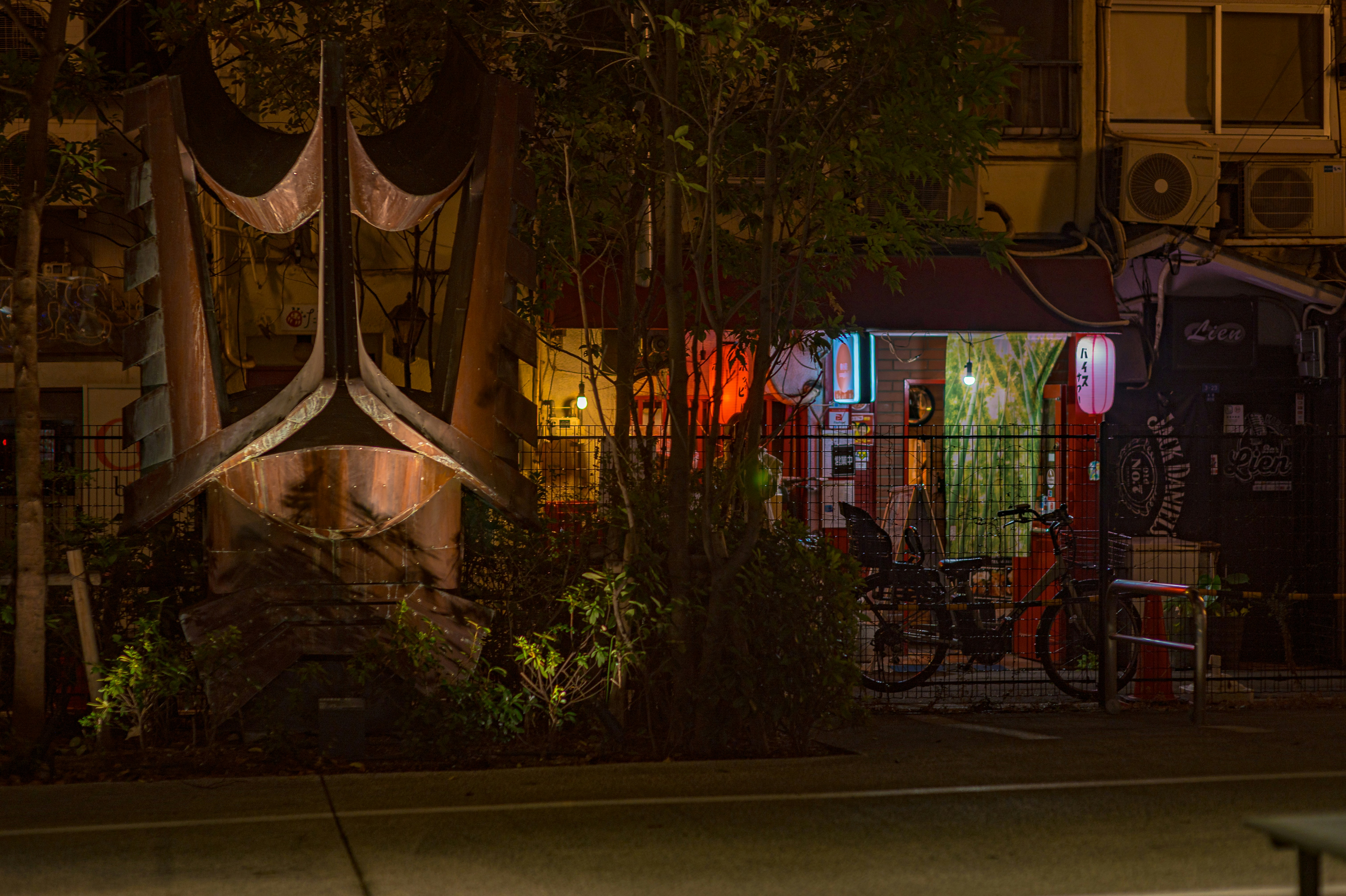 Urban Sculpture Illuminated: A Nighttime Encounter