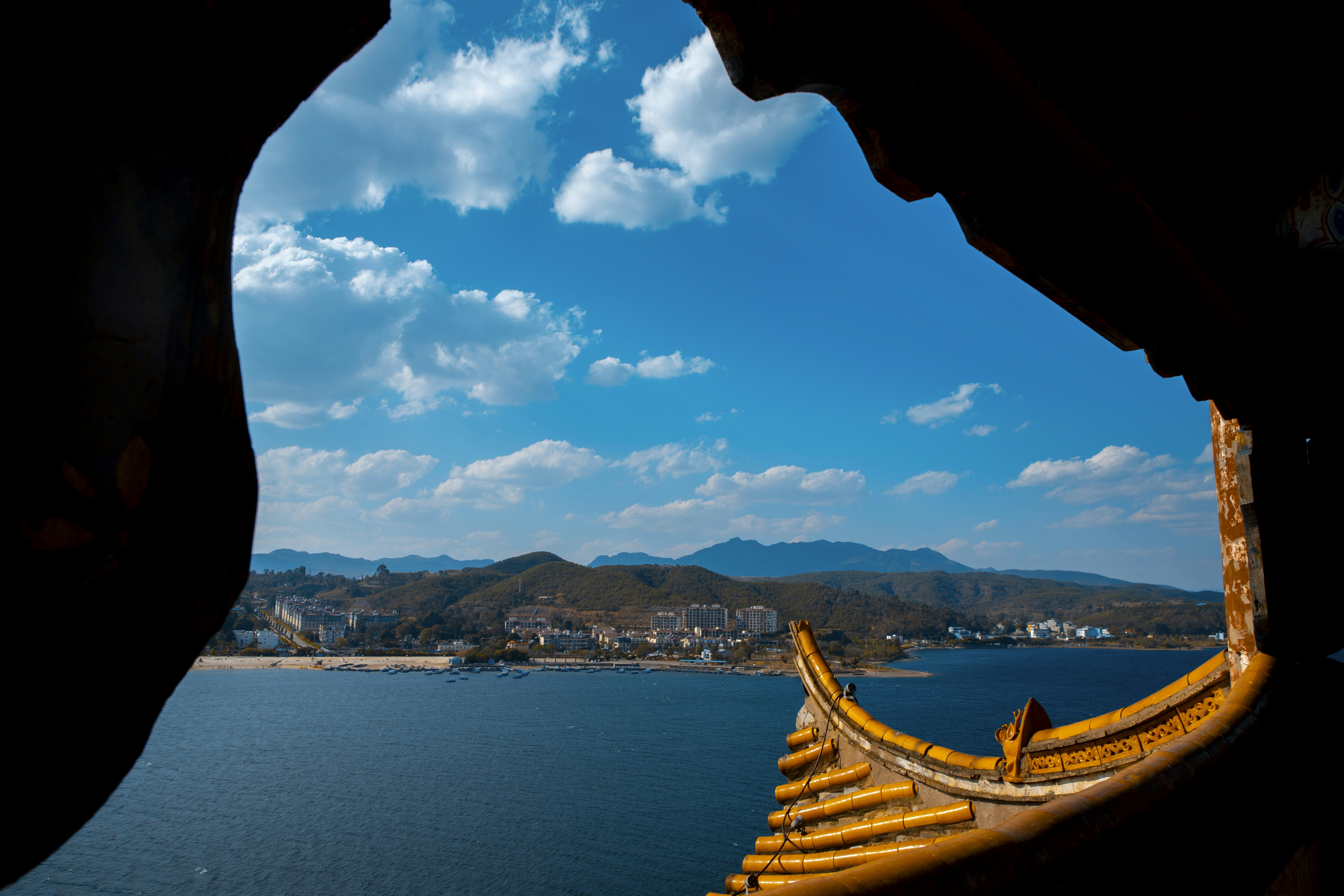 Framed Serenity: A Coastal Vista Through Ancient Architecture