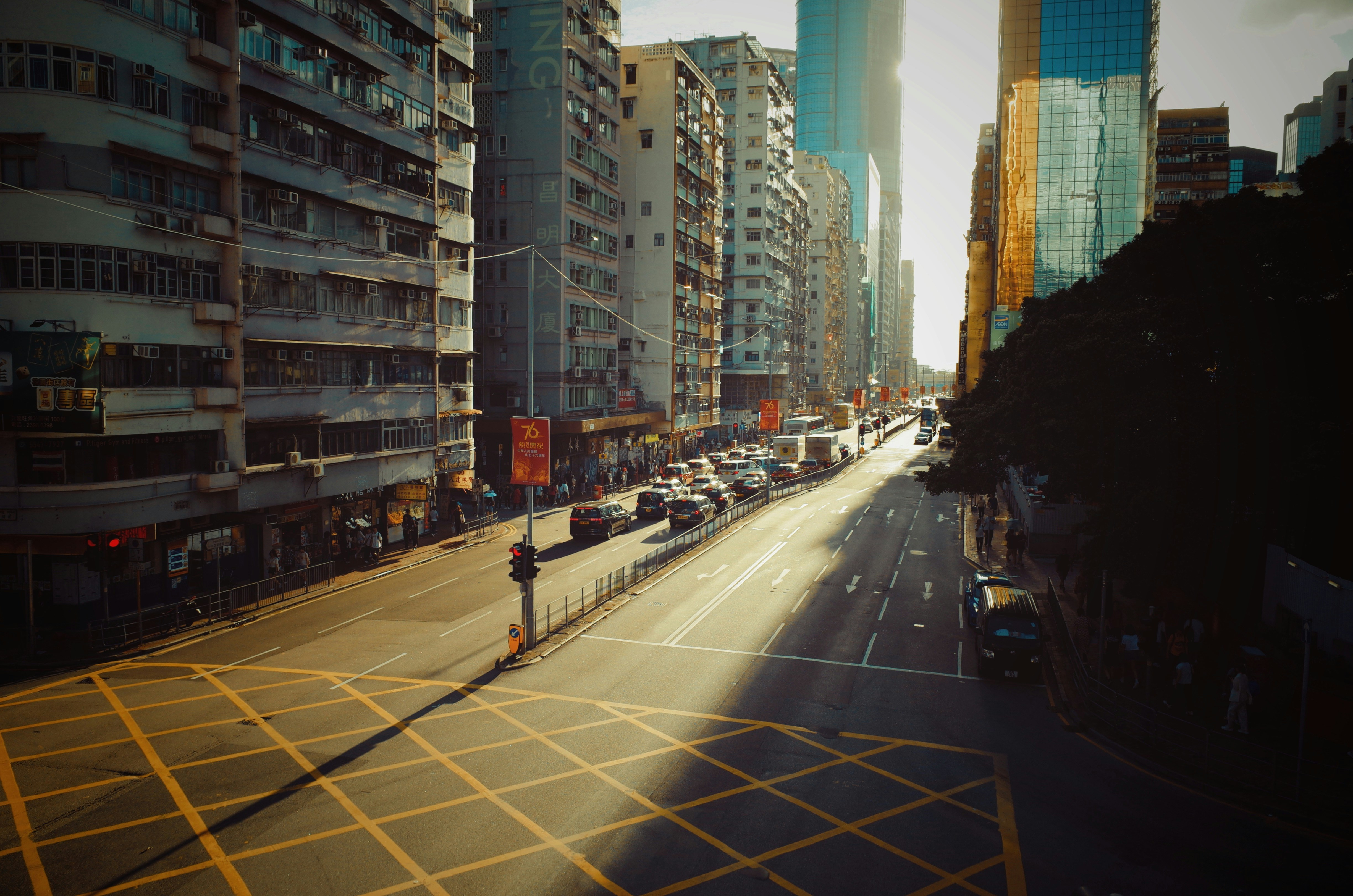Busy city street with tall buildings and cars.