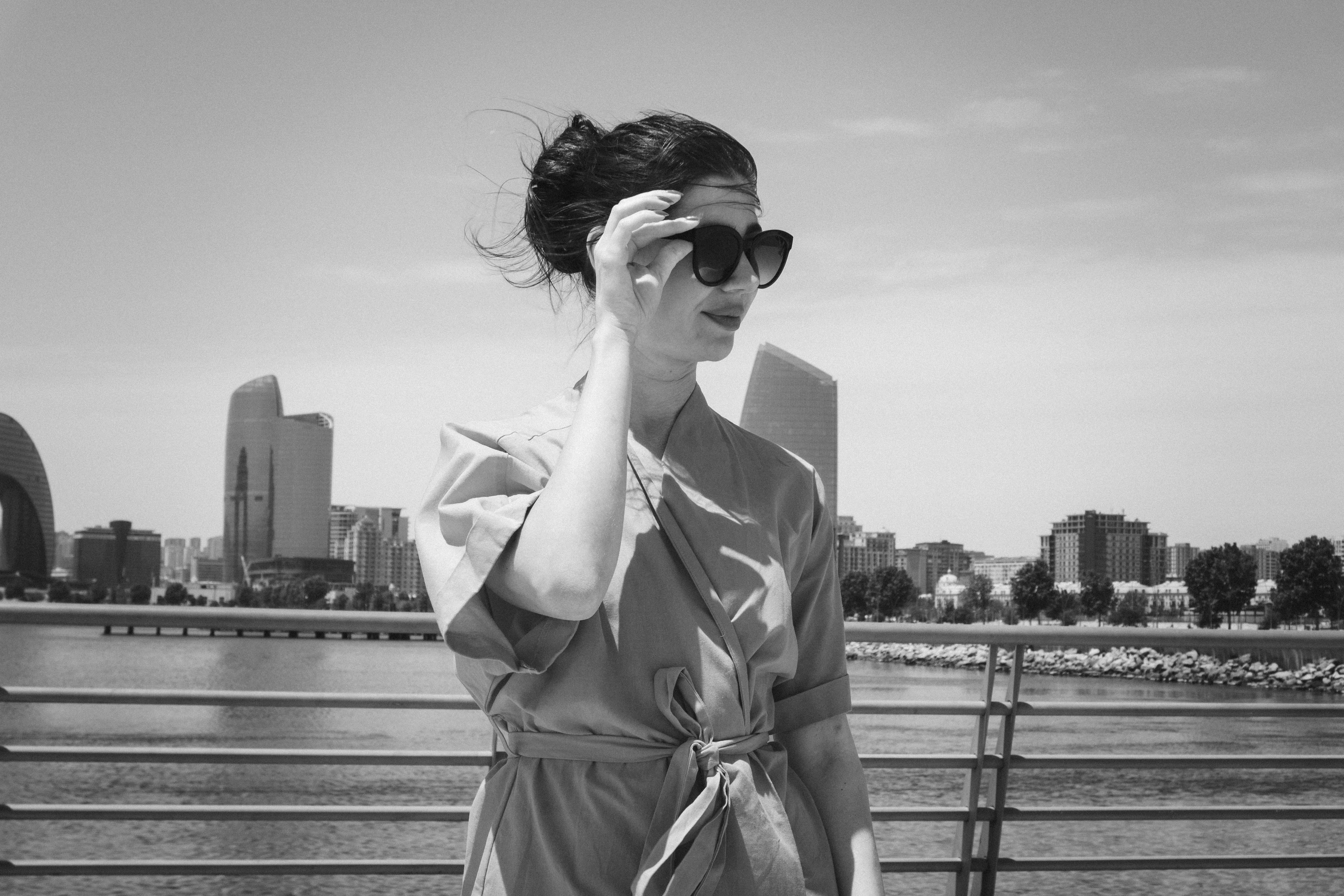 Monochrome Riverfront Portrait: Quiet Confidence by the City