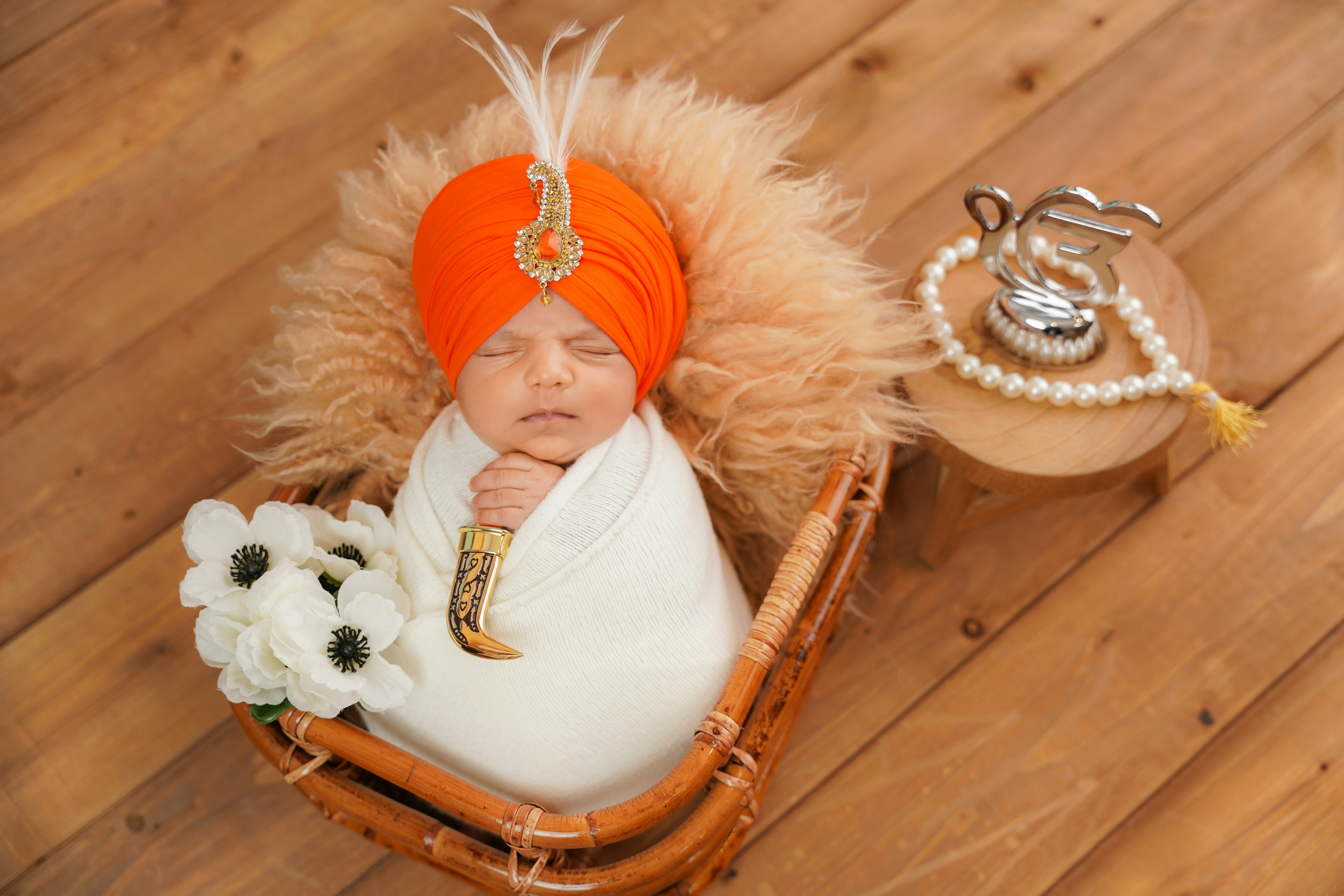 Ember Crown in a Wicker Cradle: A Newborn Portrait