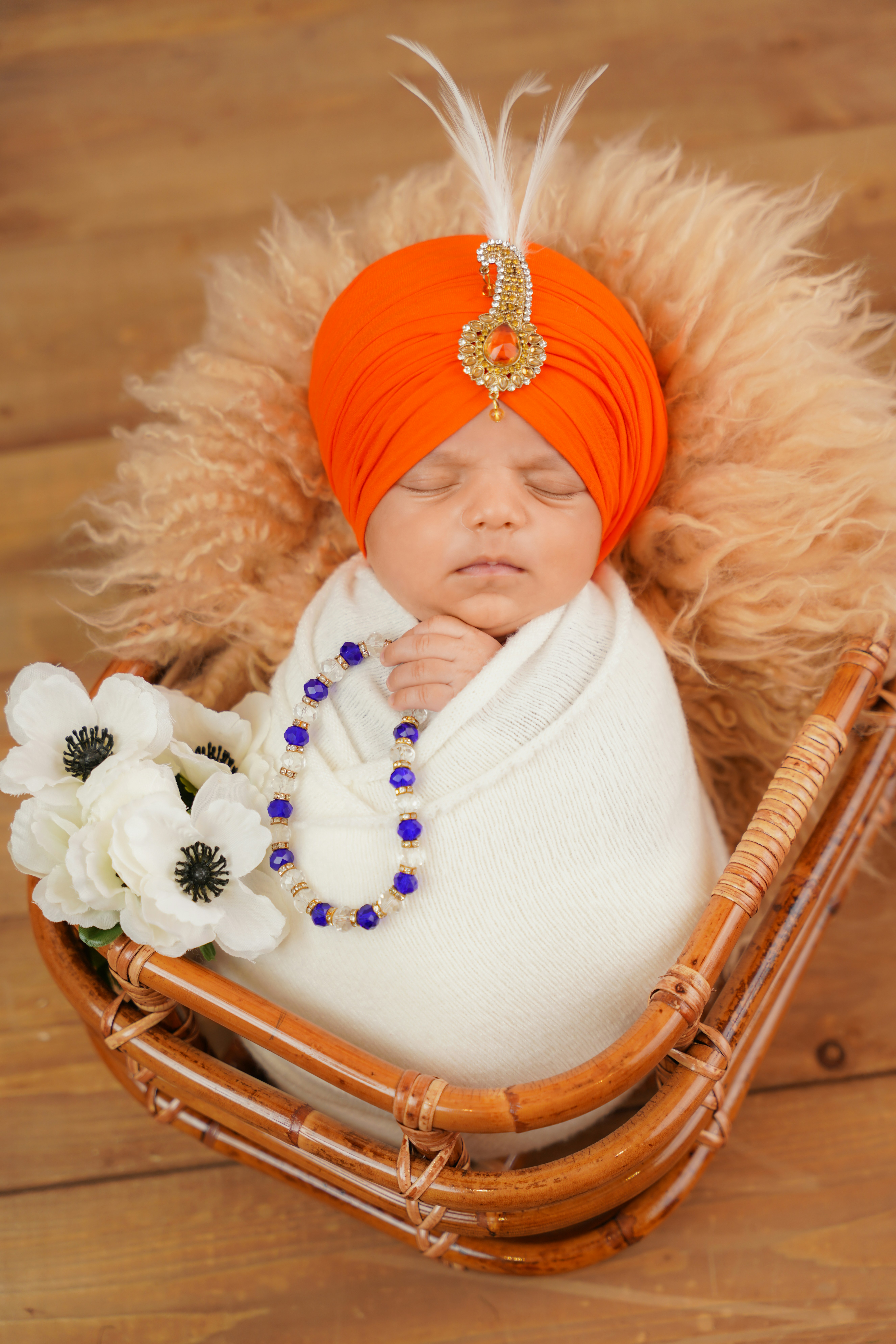 Orange Turban, Velvet Cradle: A Newborn Portrait in a Wicker Basket