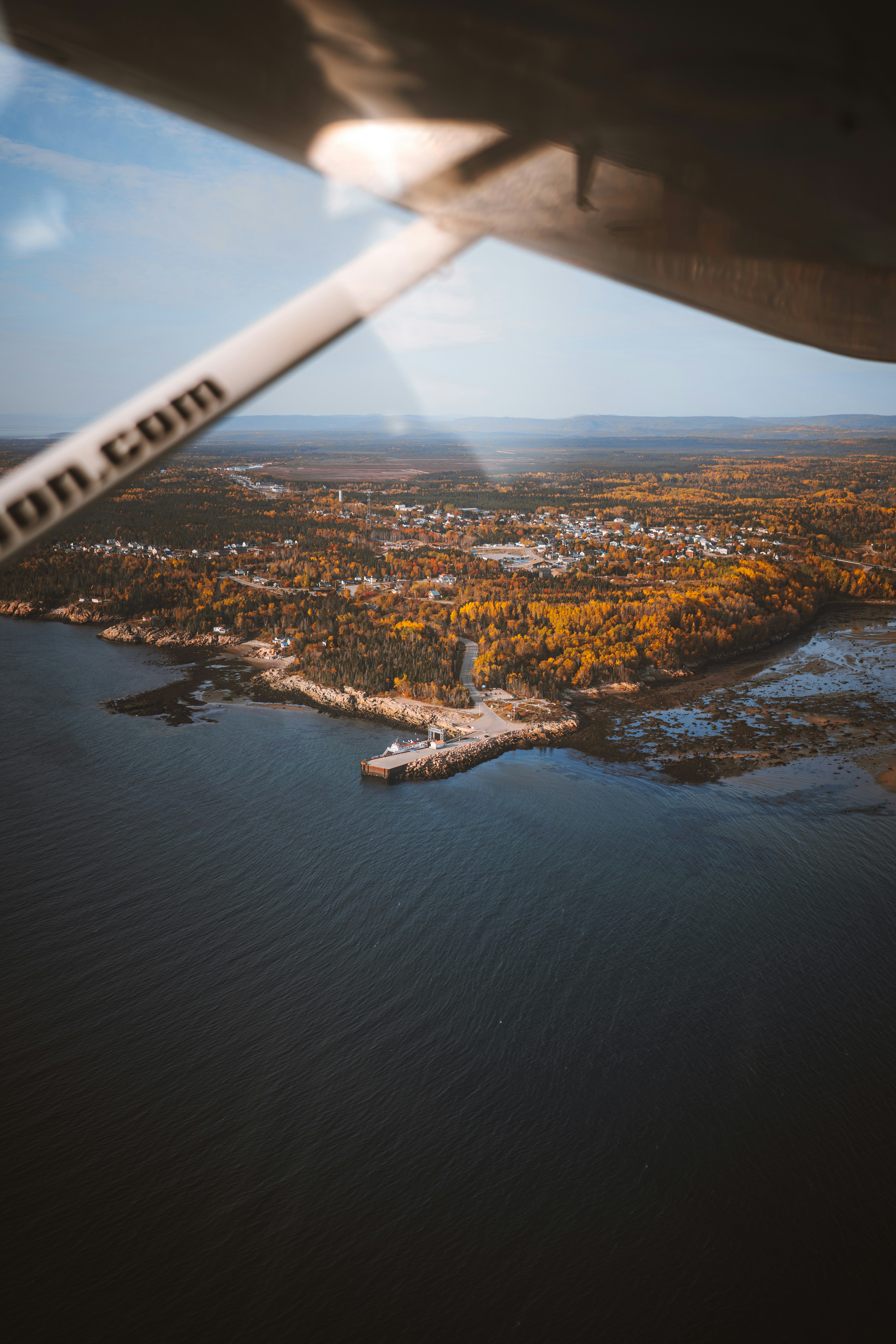 Autumn's Embrace Over Coastal Town