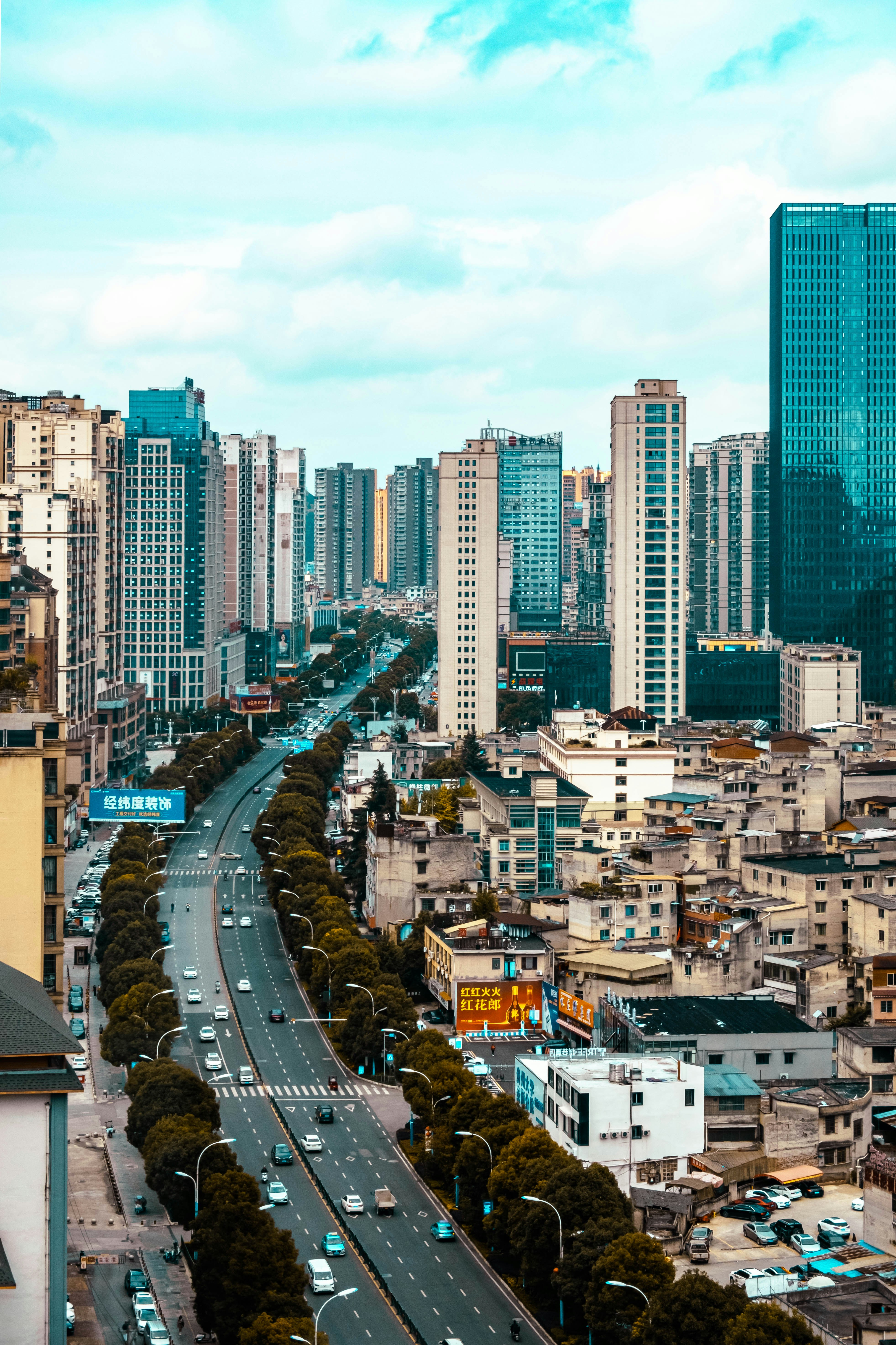 Busy highway through a modern city with tall buildings.