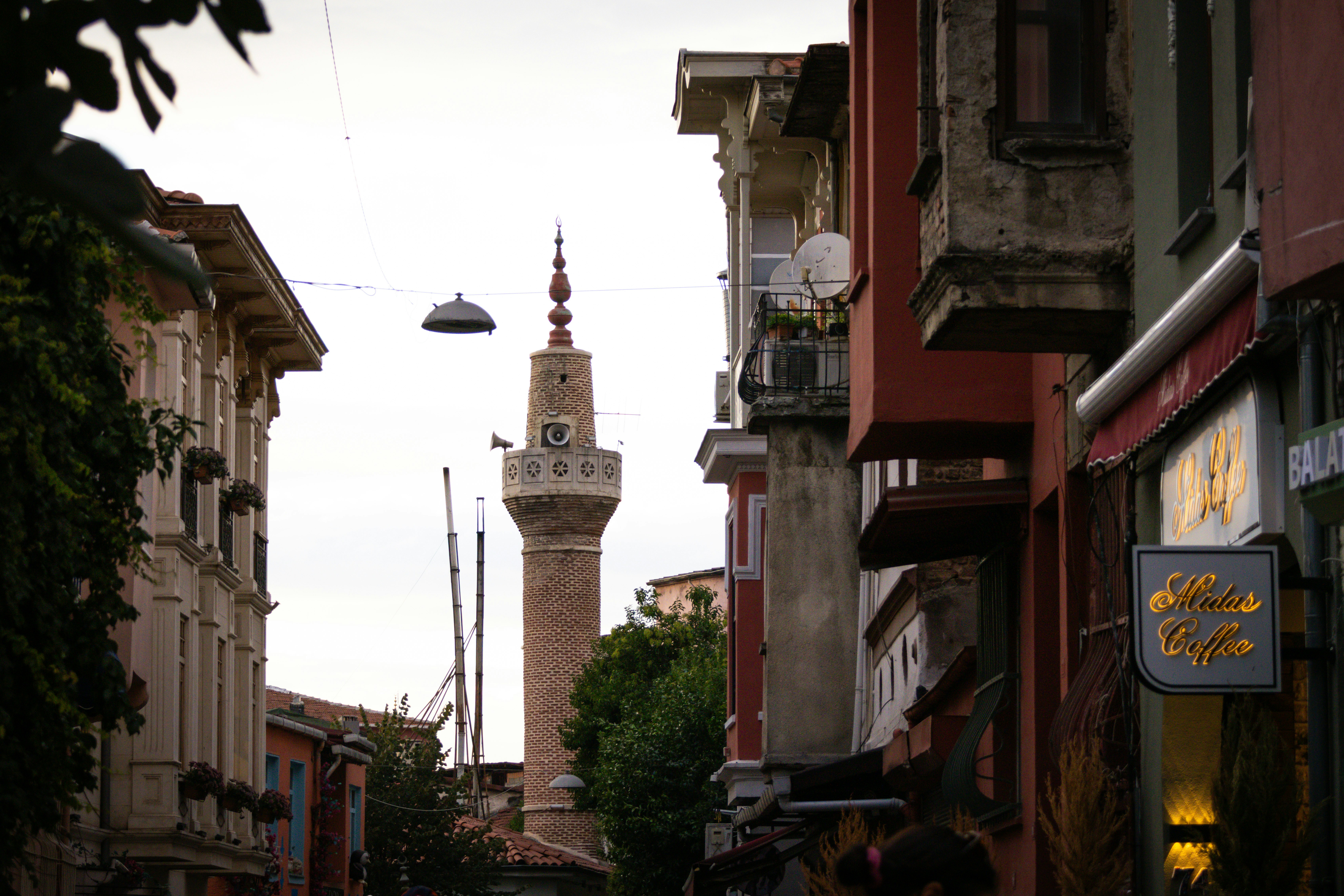 Minaret in a Narrow Street: Dusk Light Framing a City Moment