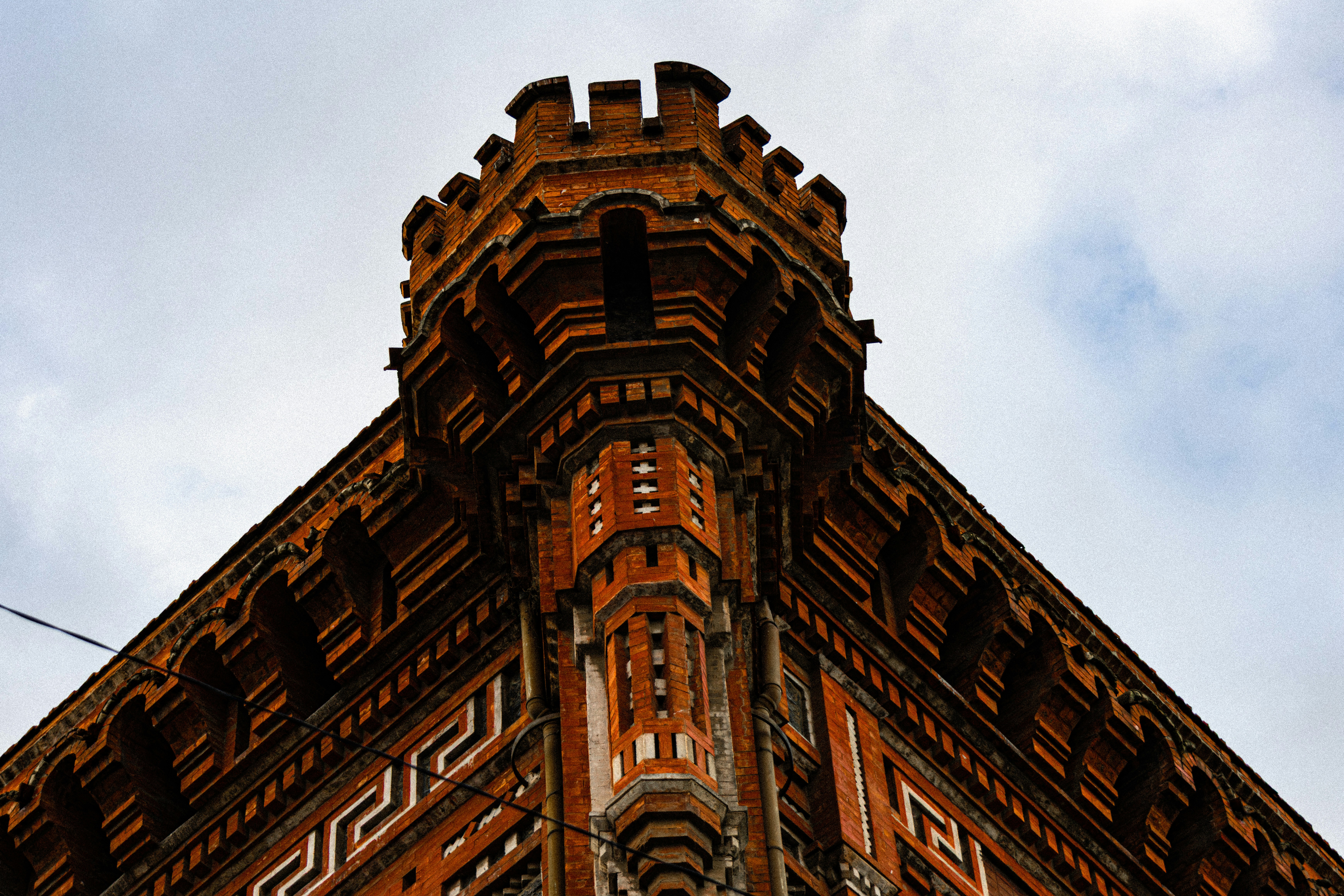 Turreted Brickwork: A Skyward Corner of Gothic Geometry