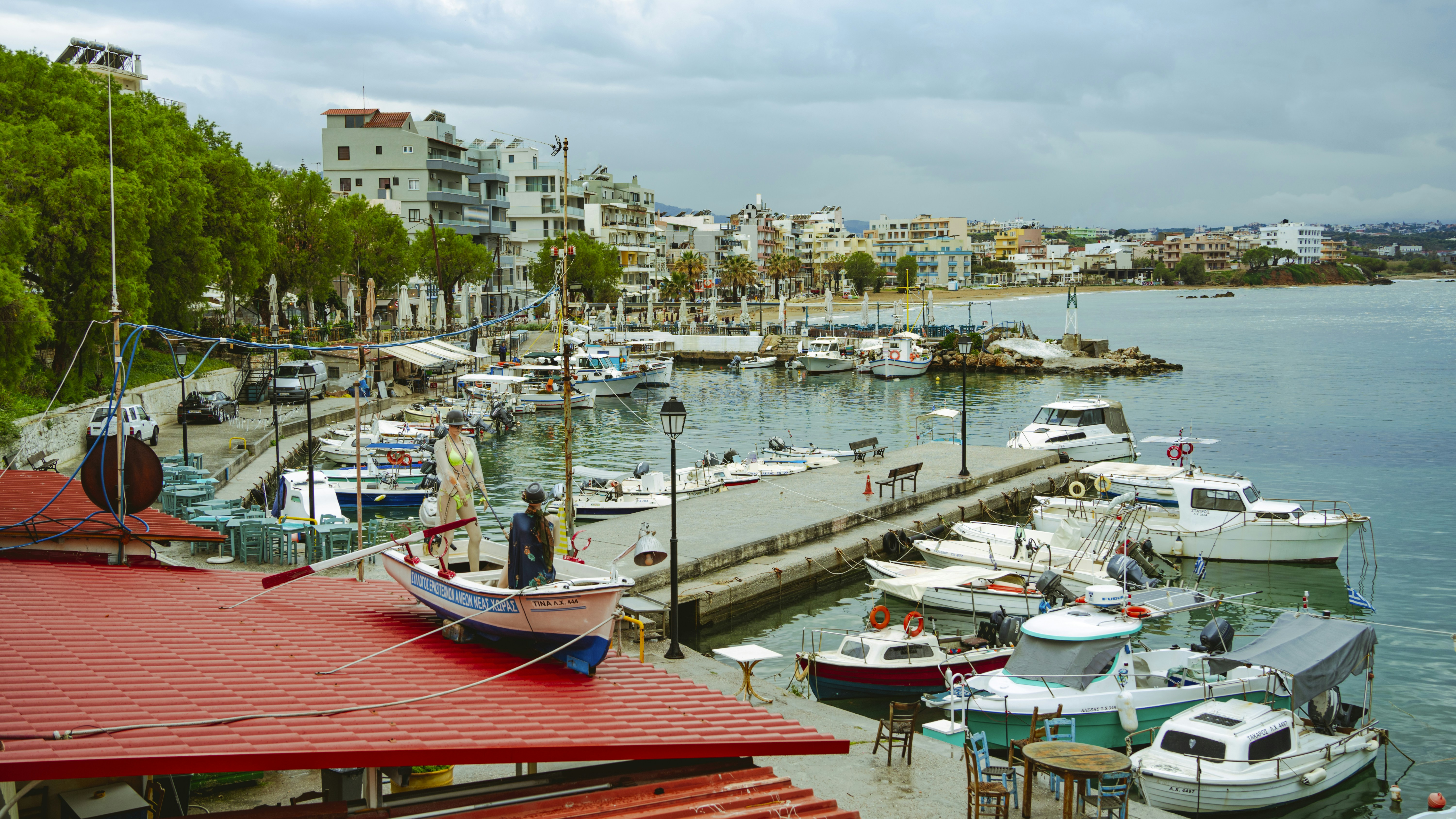 Boats docked in a coastal town harbor