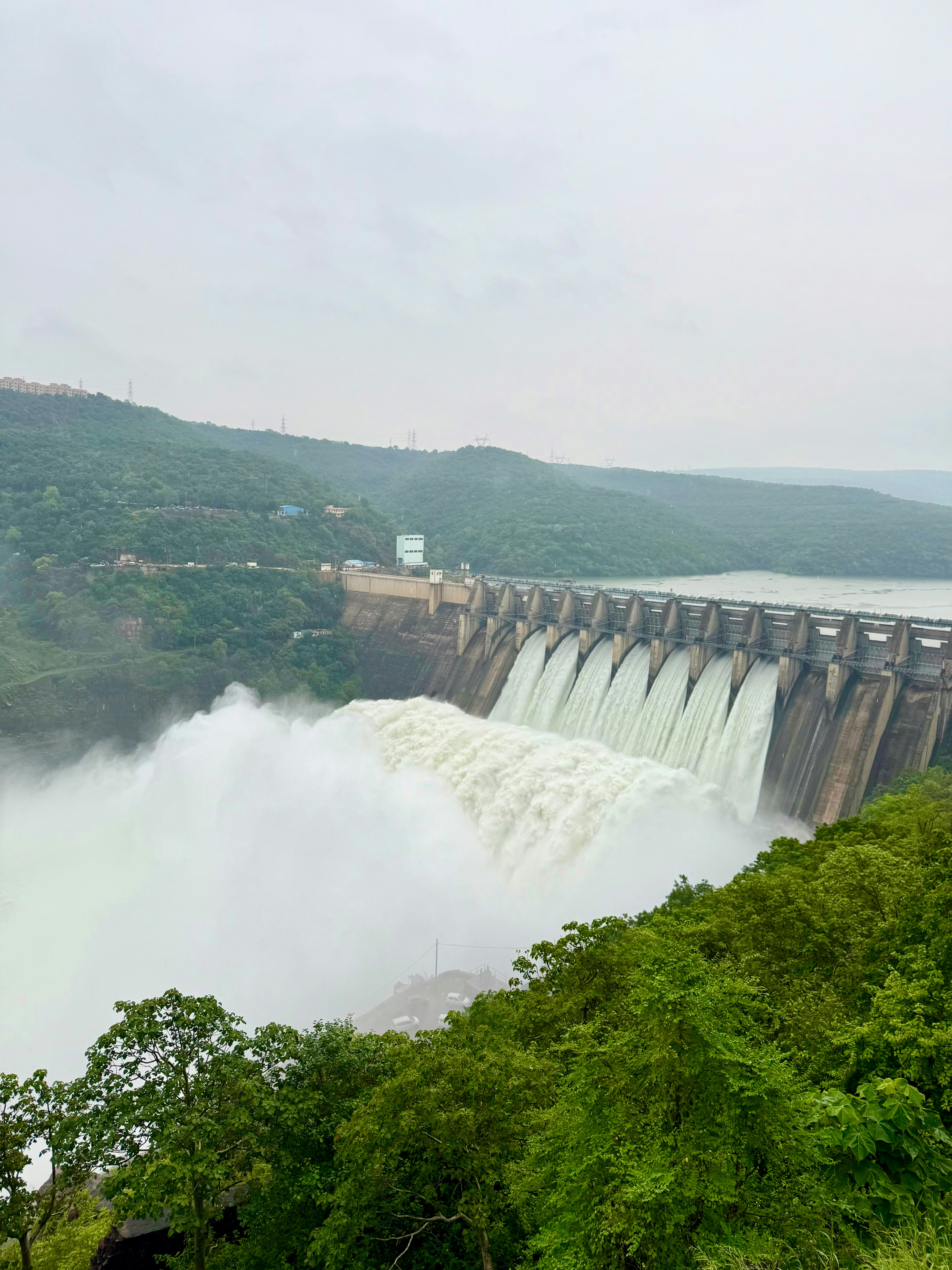 Massive dam releasing water with a powerful spray. photo – Free ...
