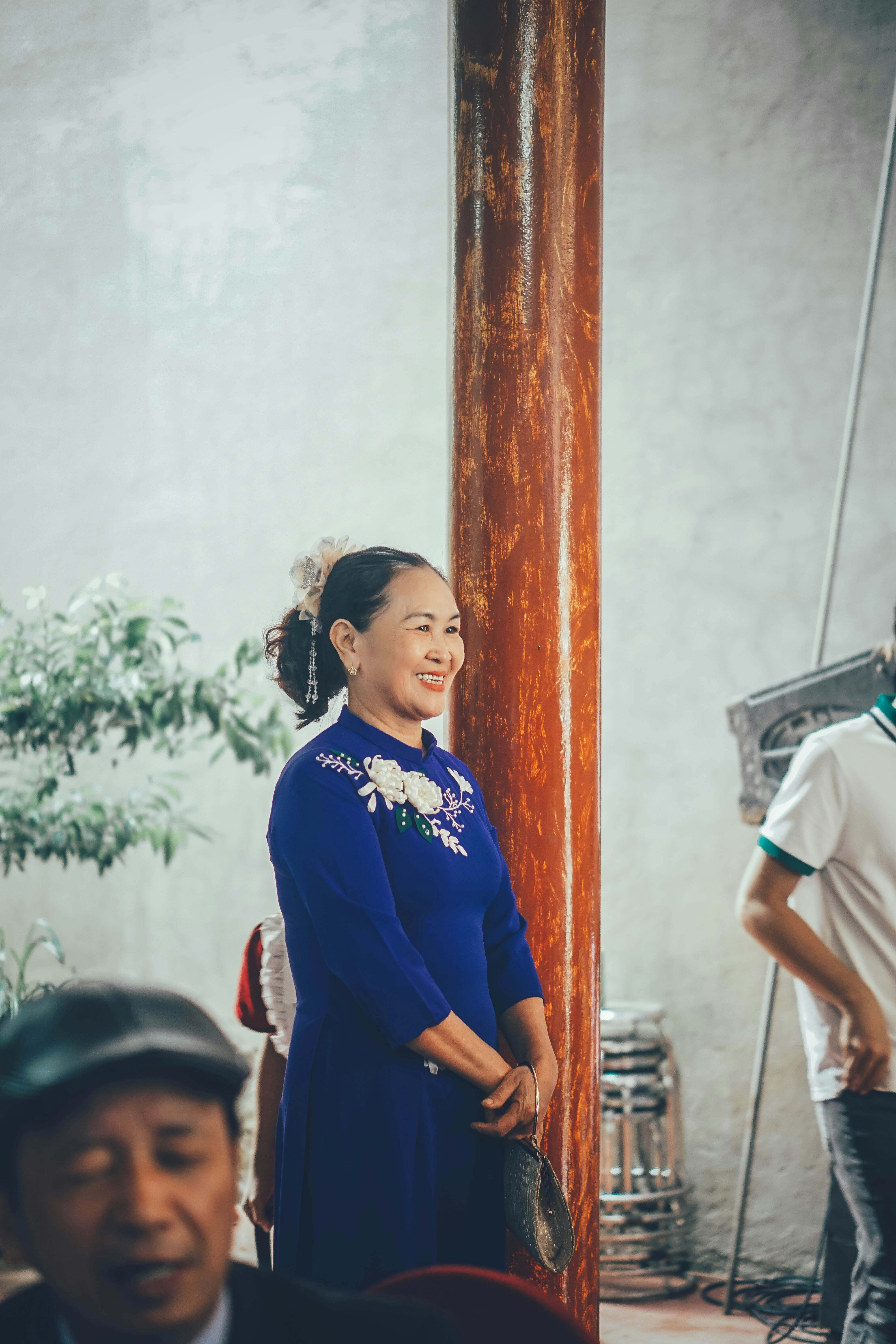 Blue Ao Dai Serenade by a Crimson Column