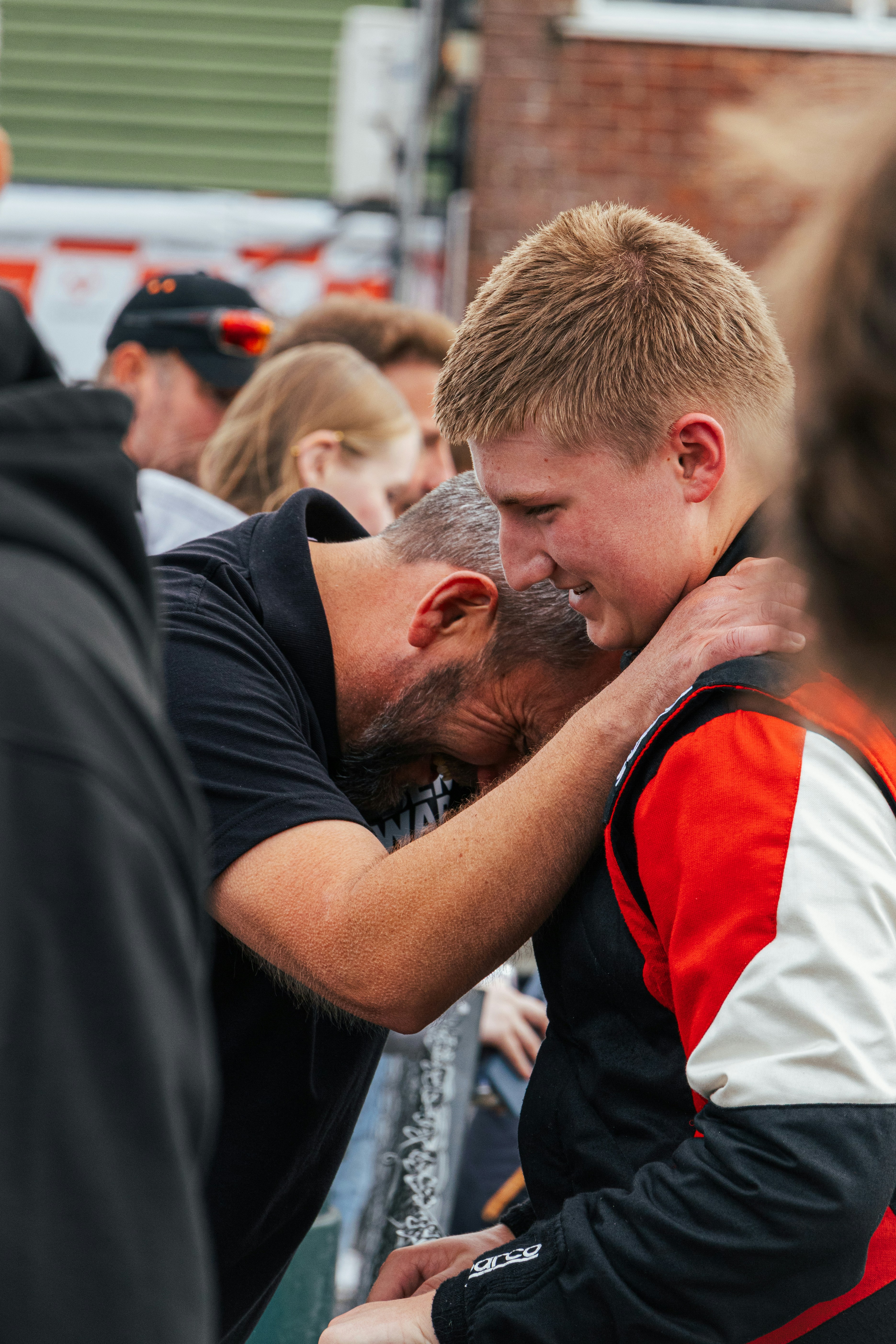 Relief in Close Quarters: A Quiet Hug After the Moment