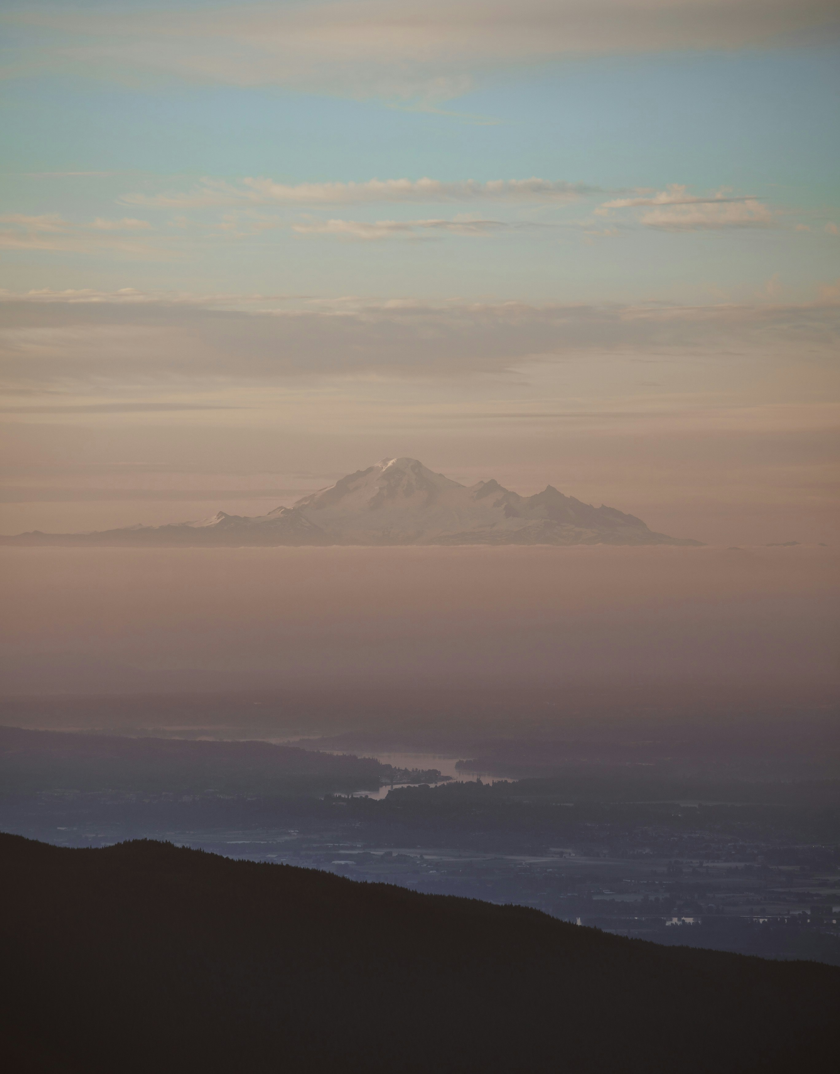 Veil of Mist Over Majestic Peaks