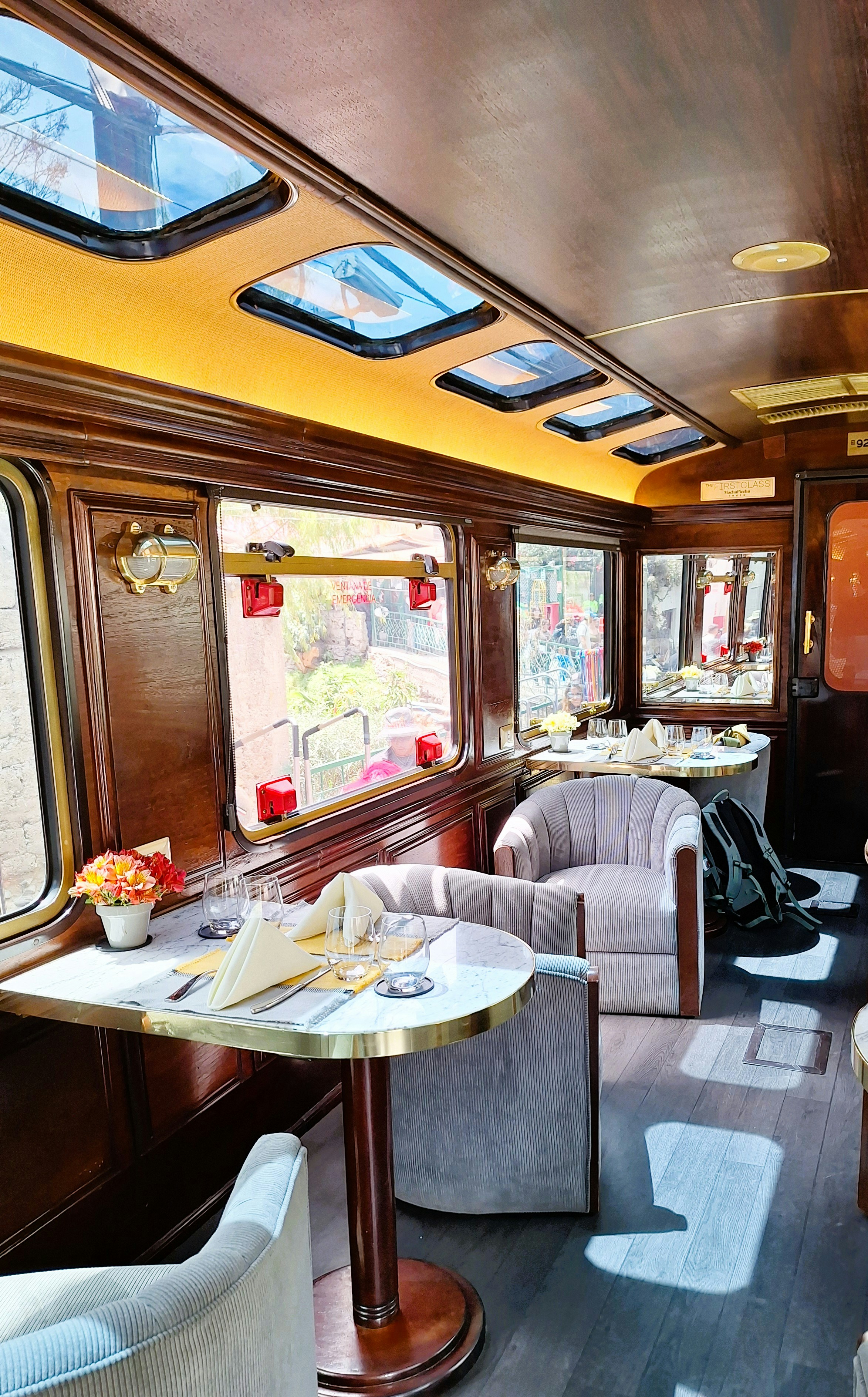Luxurious train carriage interior with dining tables and seating. photo ...