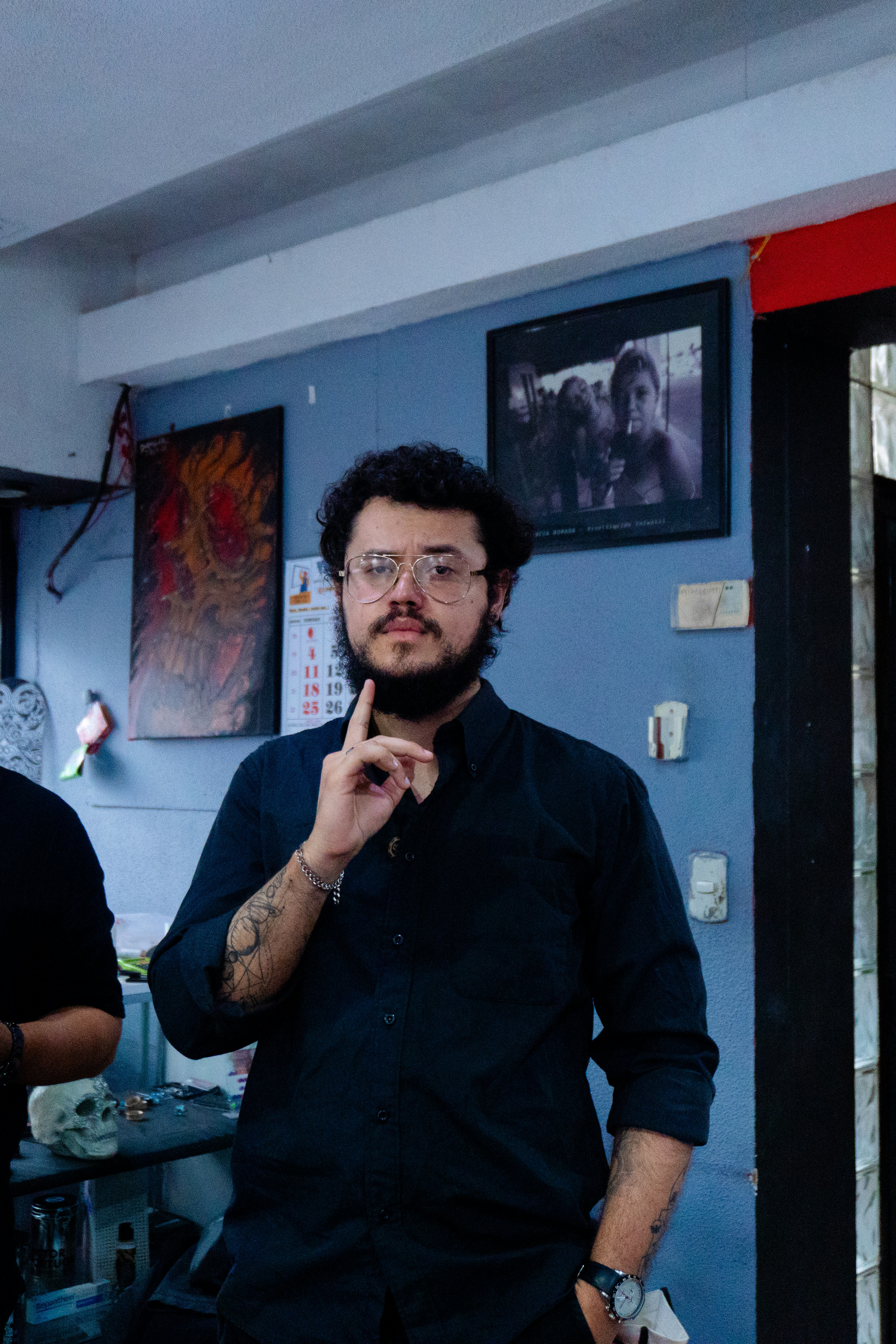 Confidence in Focus: A Beard and Glasses Moment in a Studio