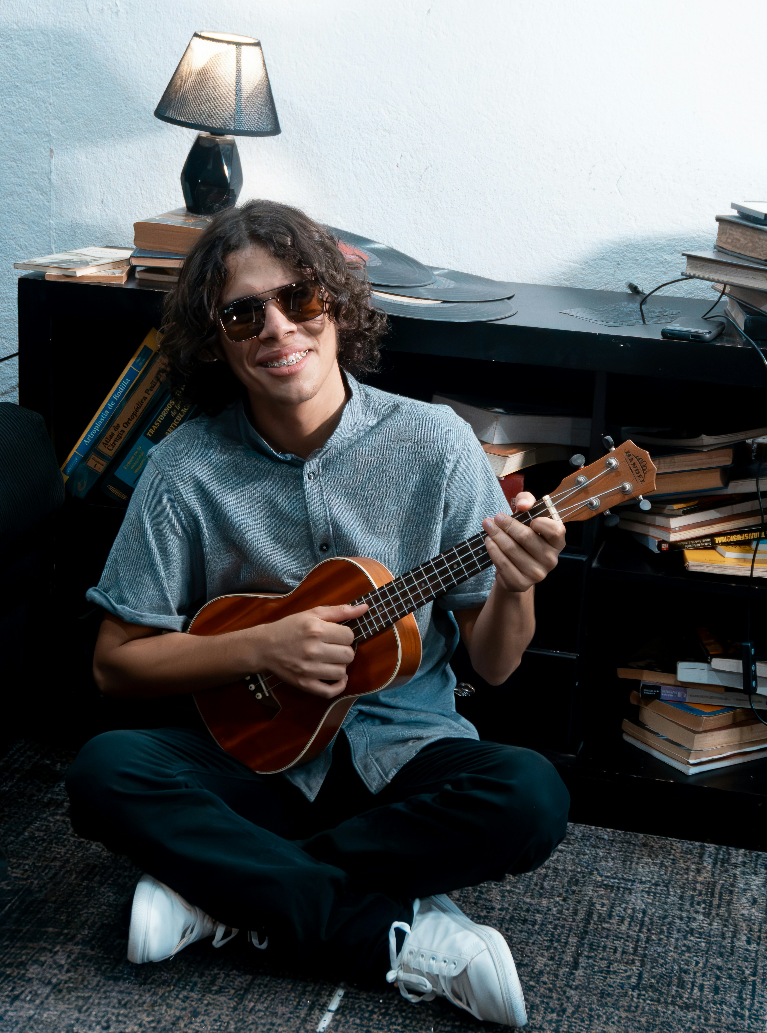 Harmonics Among the Stacks: A Ukulele Player in a Cozy Bookroom
