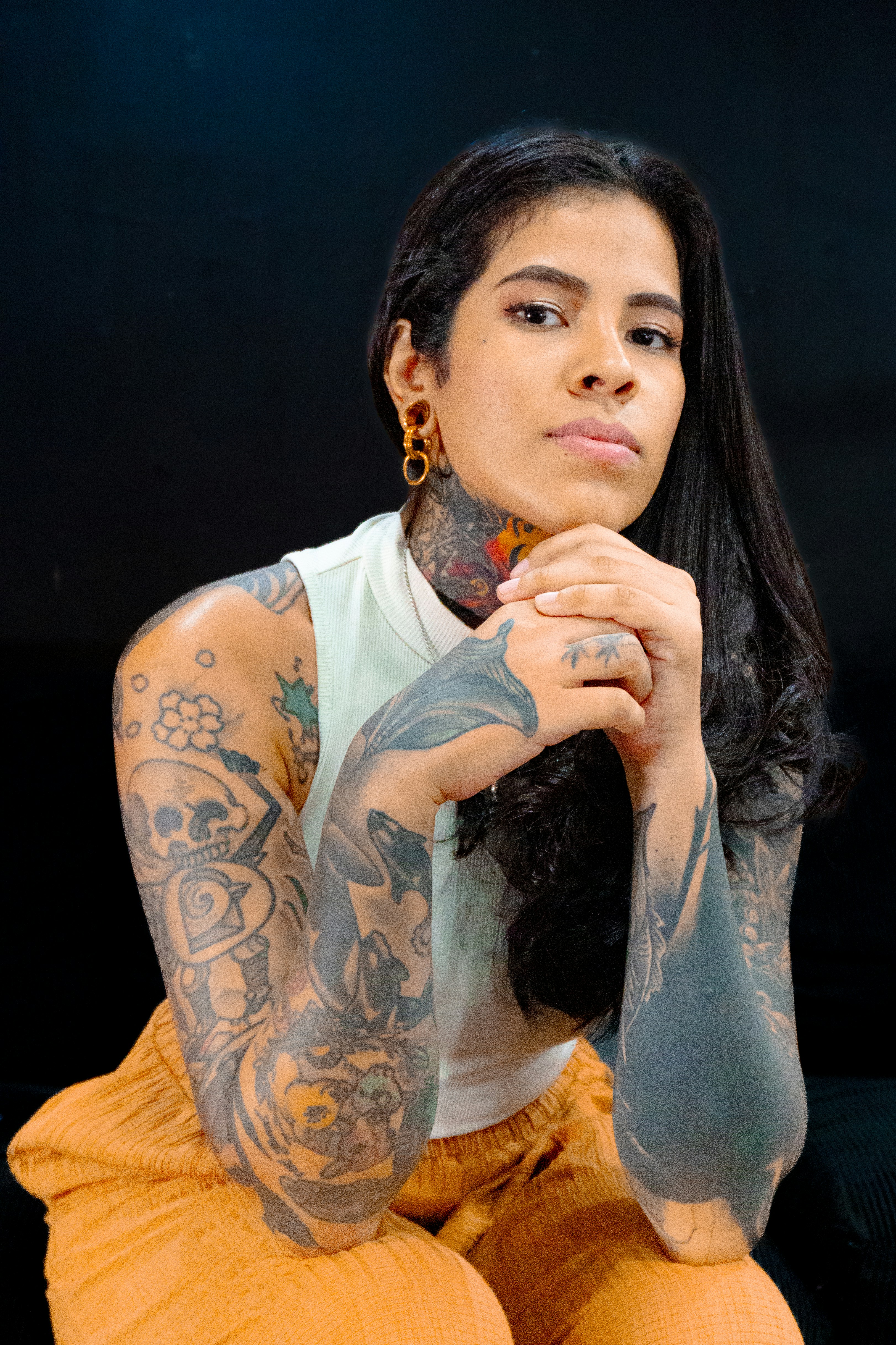 Ink and Quiet Confidence: Studio Portrait of a Tattooed Woman