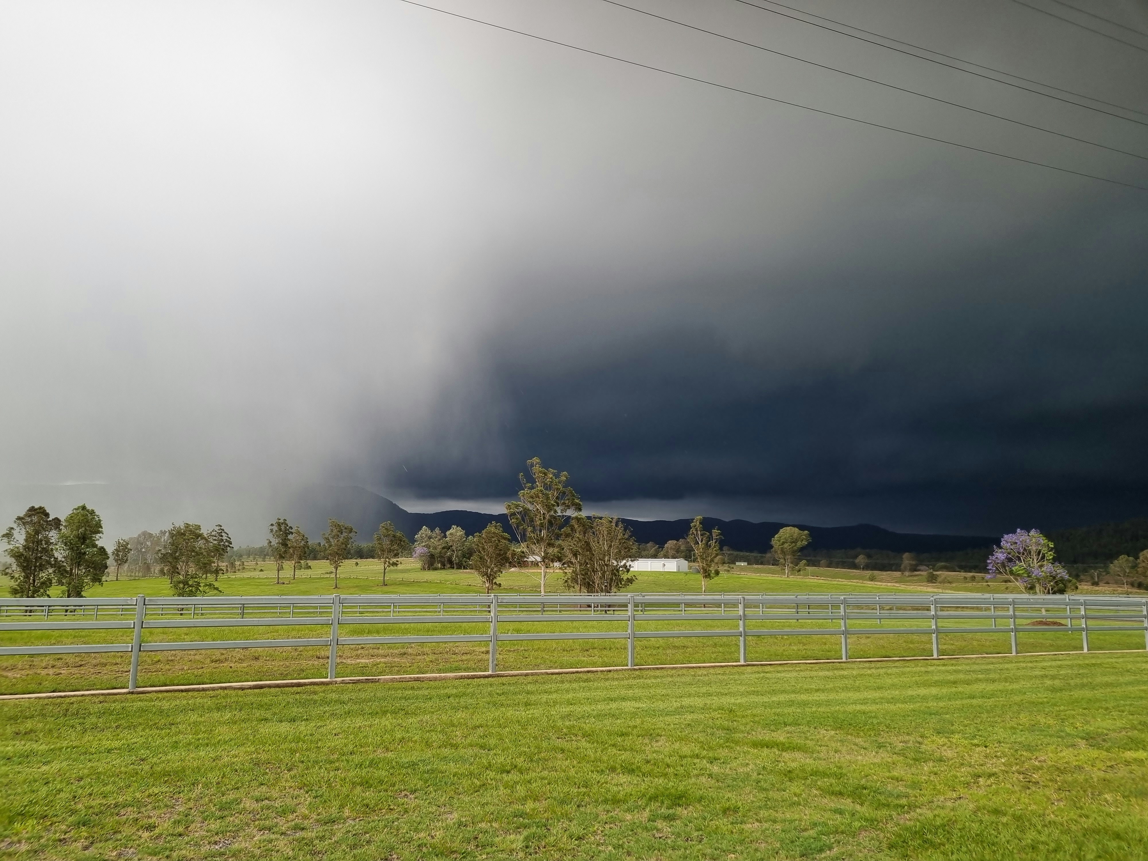 Approaching Tempest over a Quiet Prairie Fence