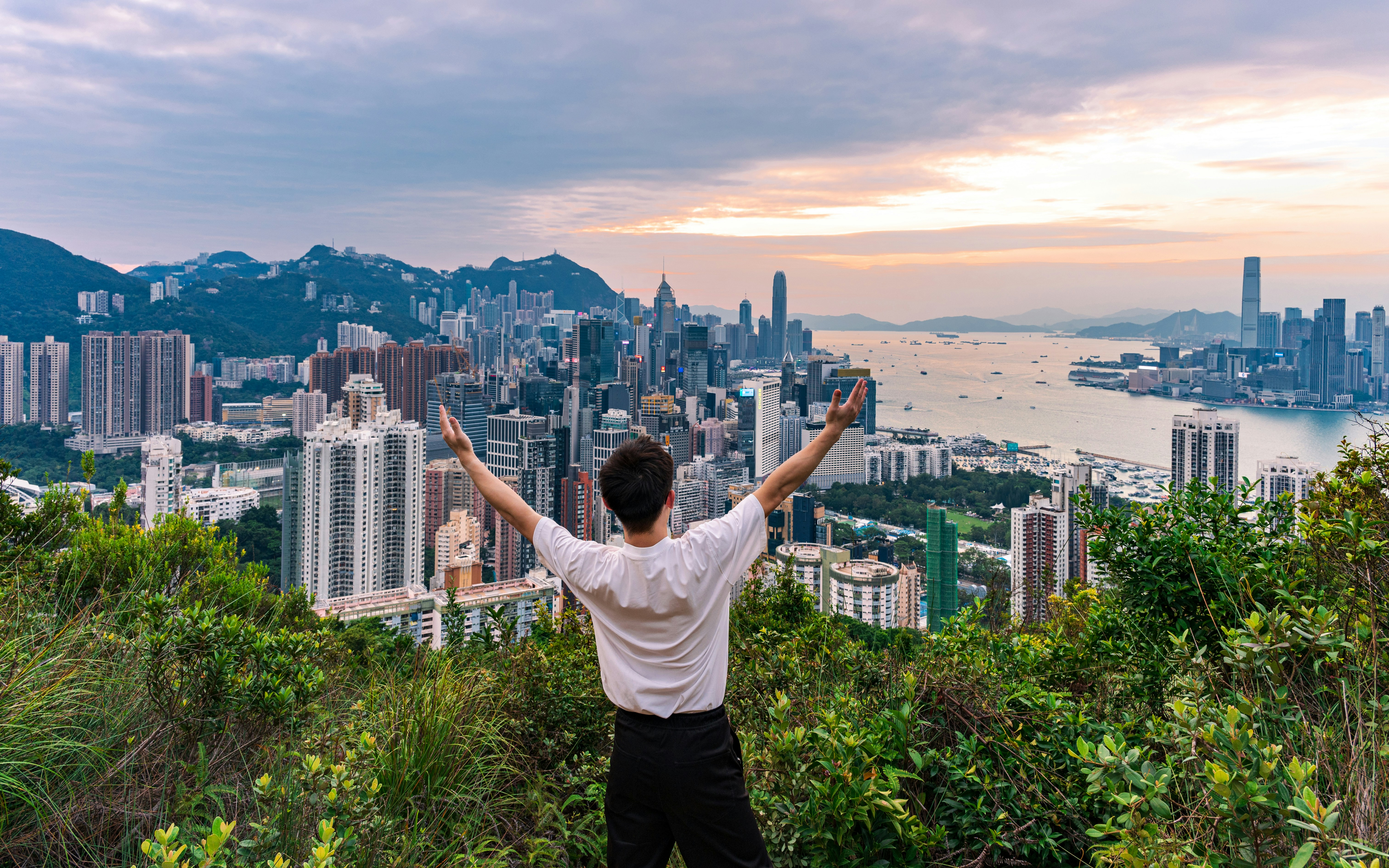 Urban Symphony: A Gesture of Freedom Against the Cityscape