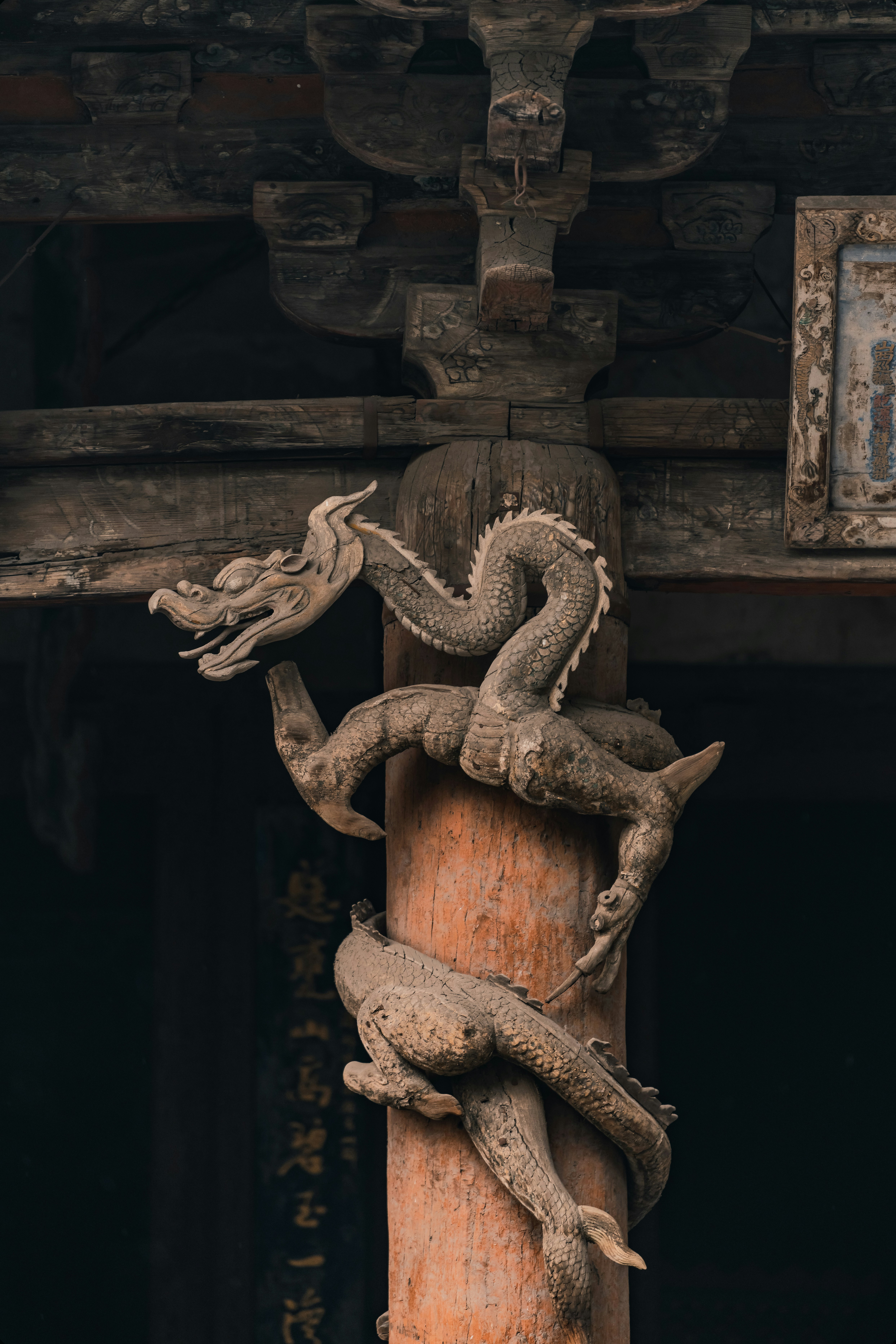 Coiled Sentinel: Dragon on a Weathered Temple Pillar