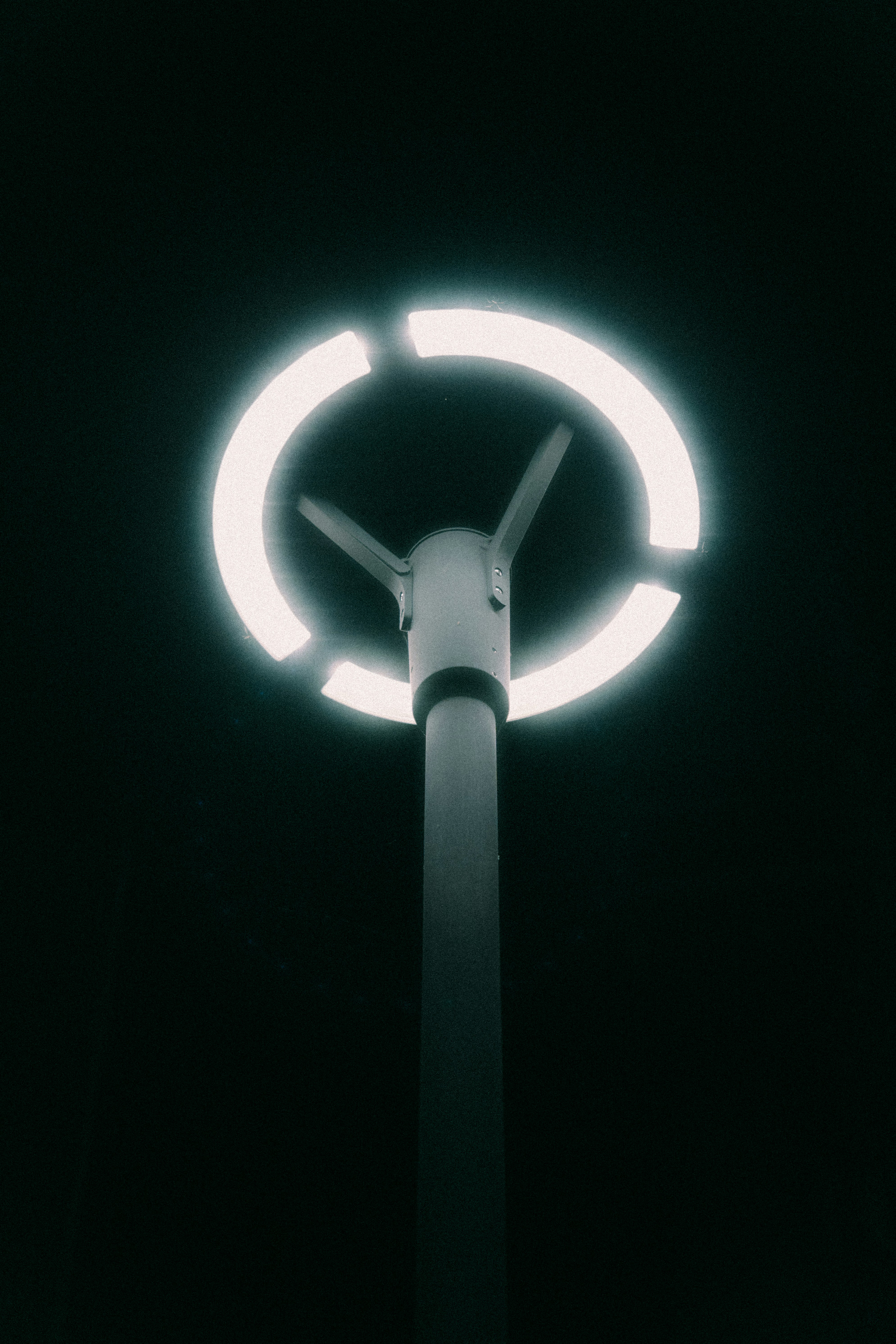 Modern street lamp with a glowing circular light