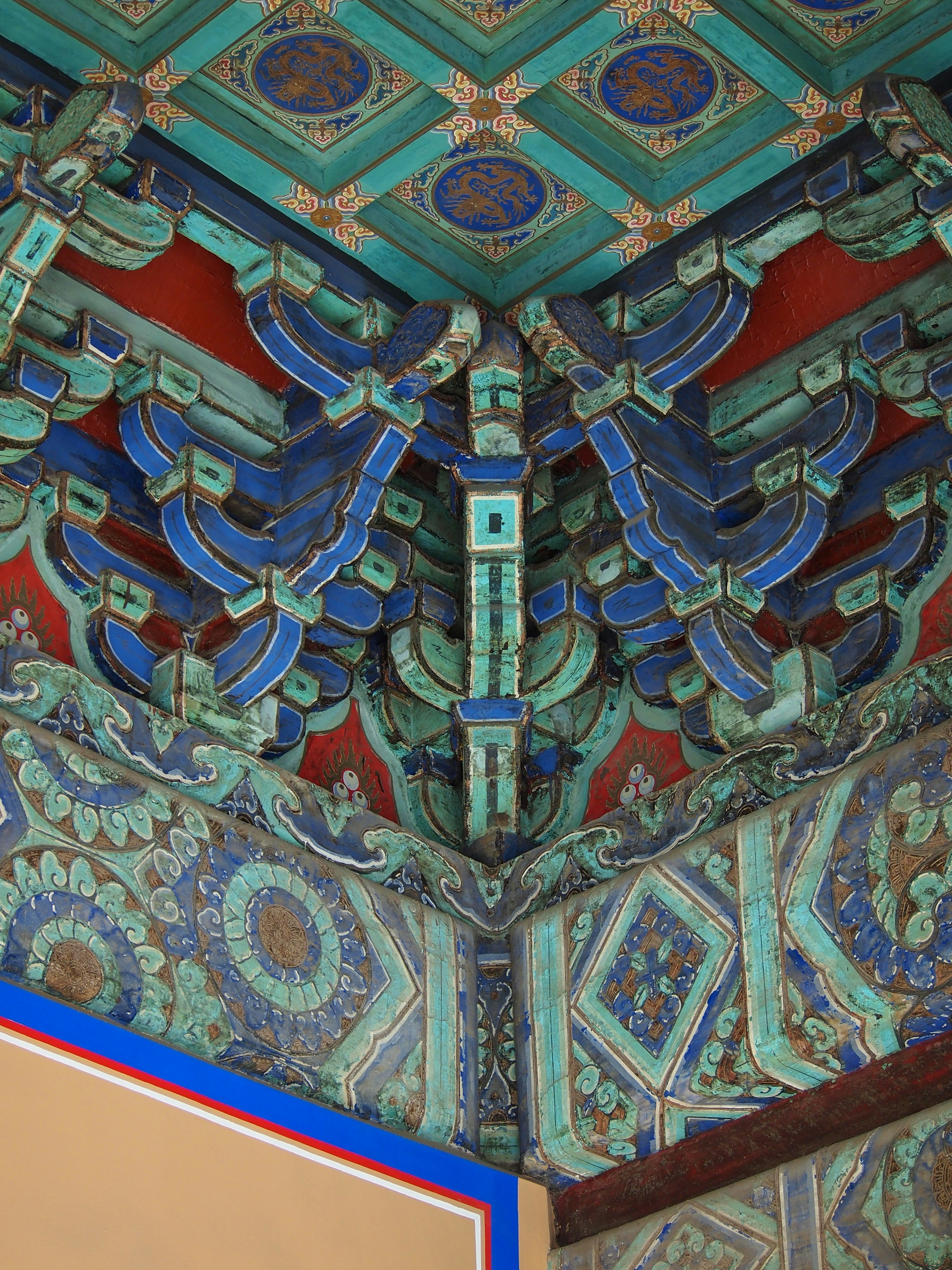 Vibrantly painted architectural details showcasing intricate patterns and designs in a historical structure.